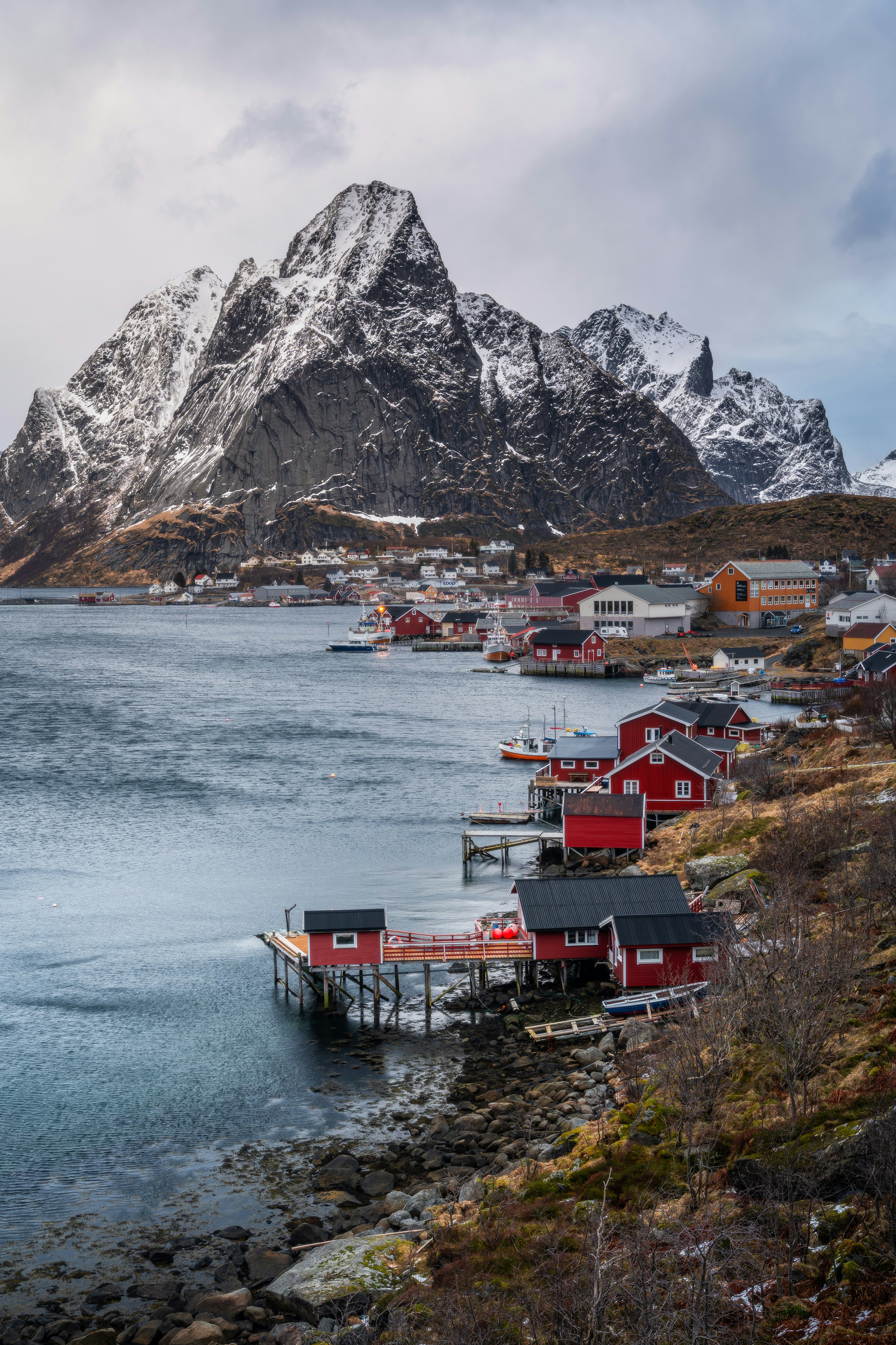 Snow-capped Peaks Over a Colorful Seaside Fishing Village