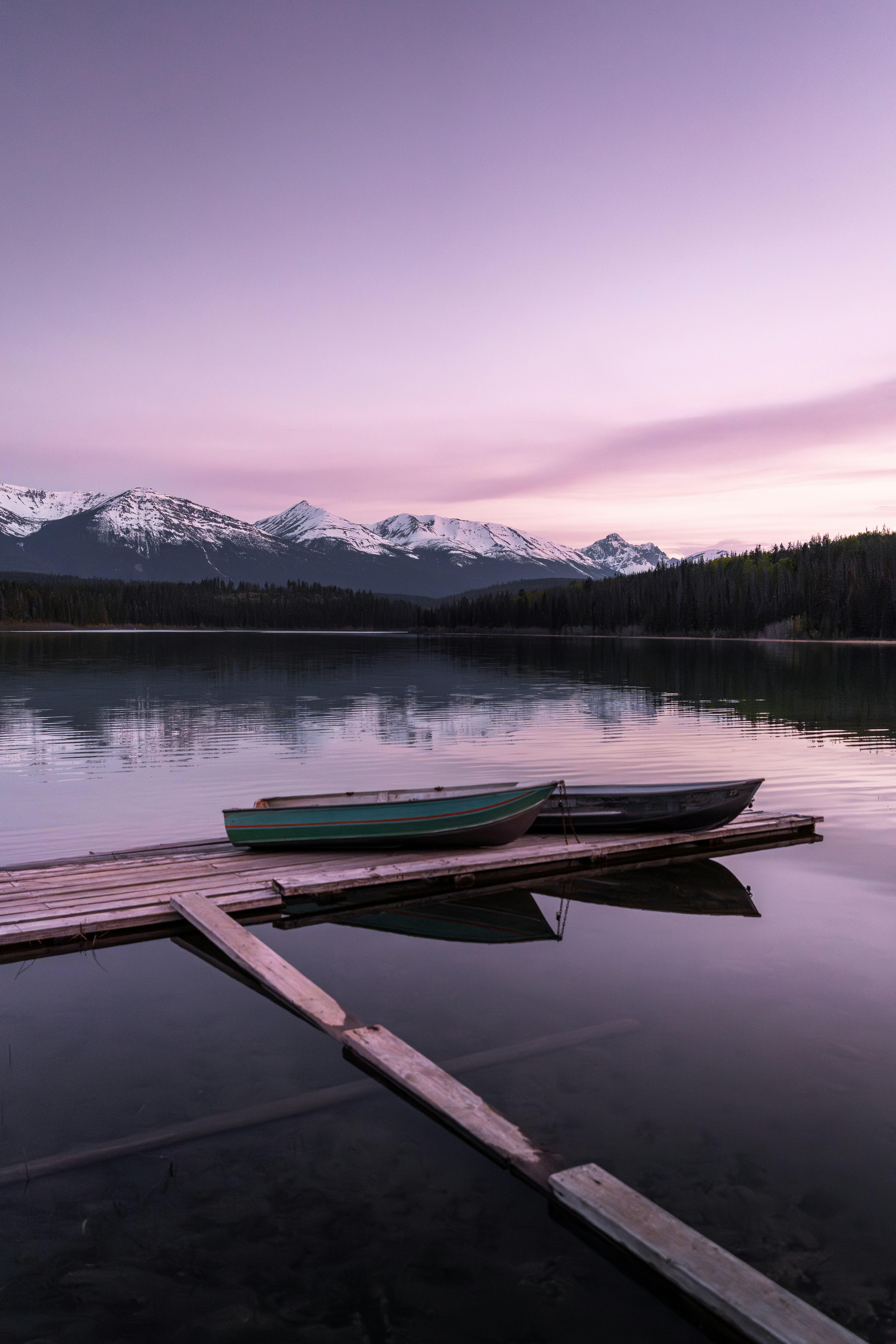 Calm Dusk on a Mountain Lake with Rowboats
