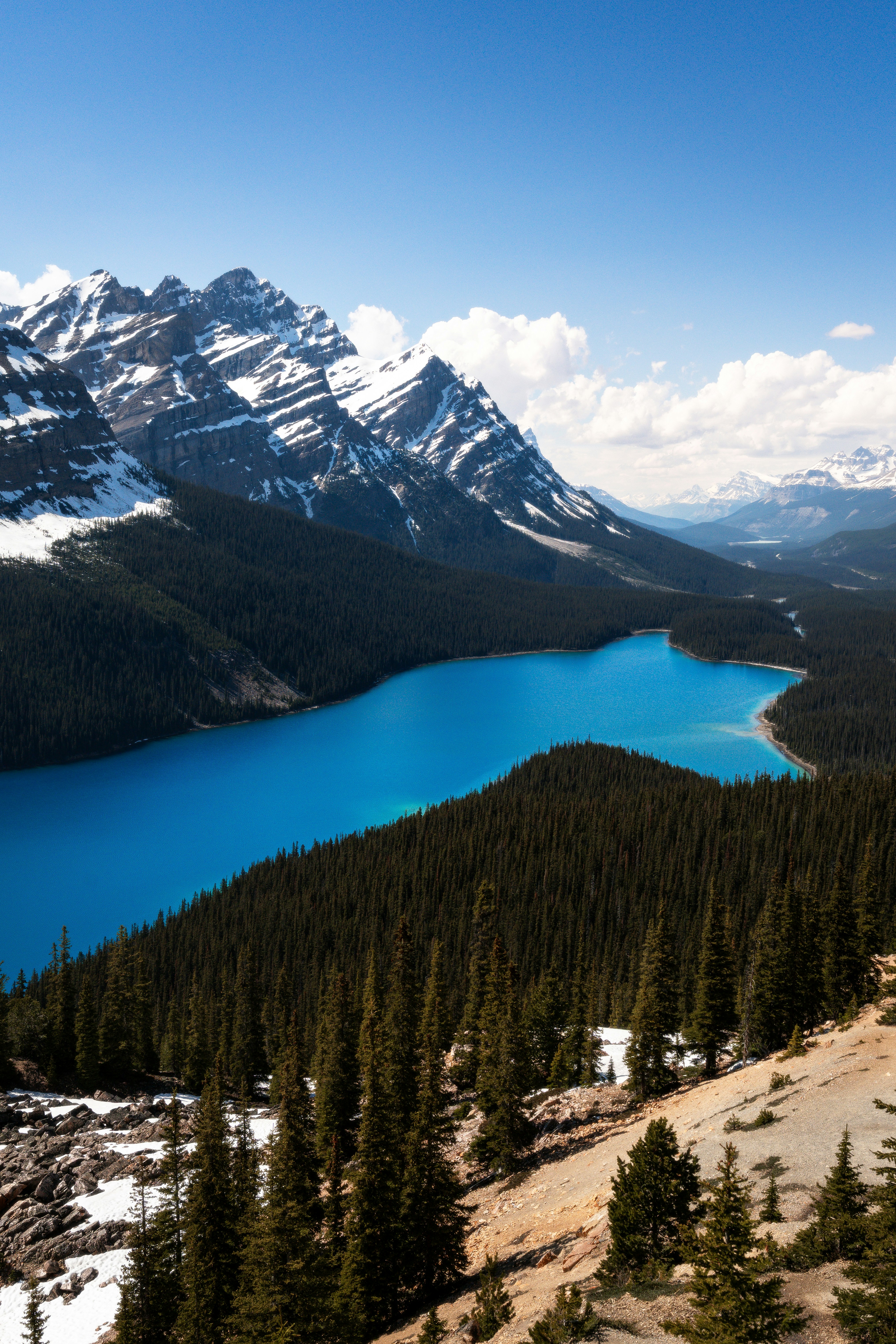 Azure Ribbon: A Glacier-Touched Lake Pierced by Peaks