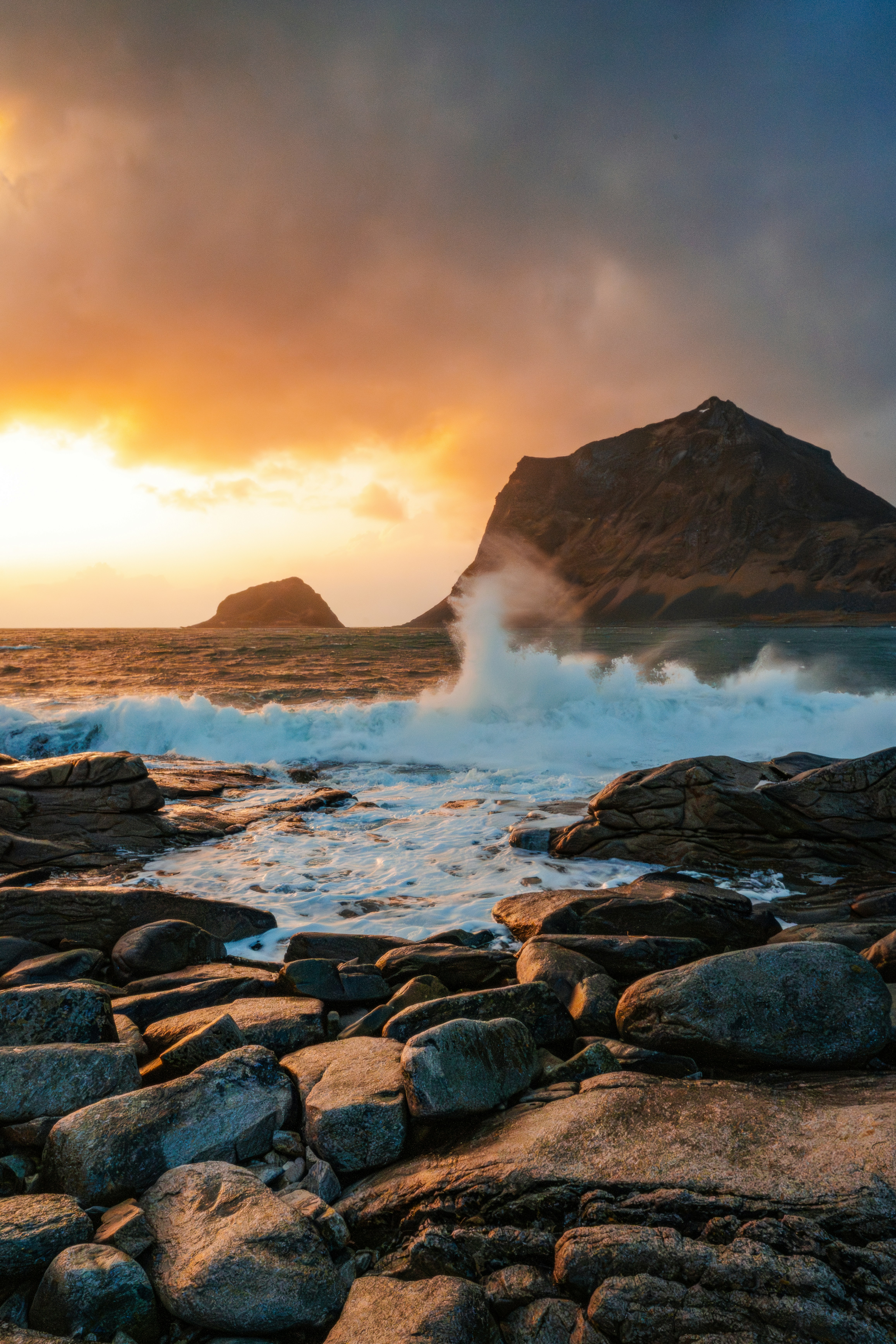 Sunlit Breakers over Rugged Rocks at Dusk