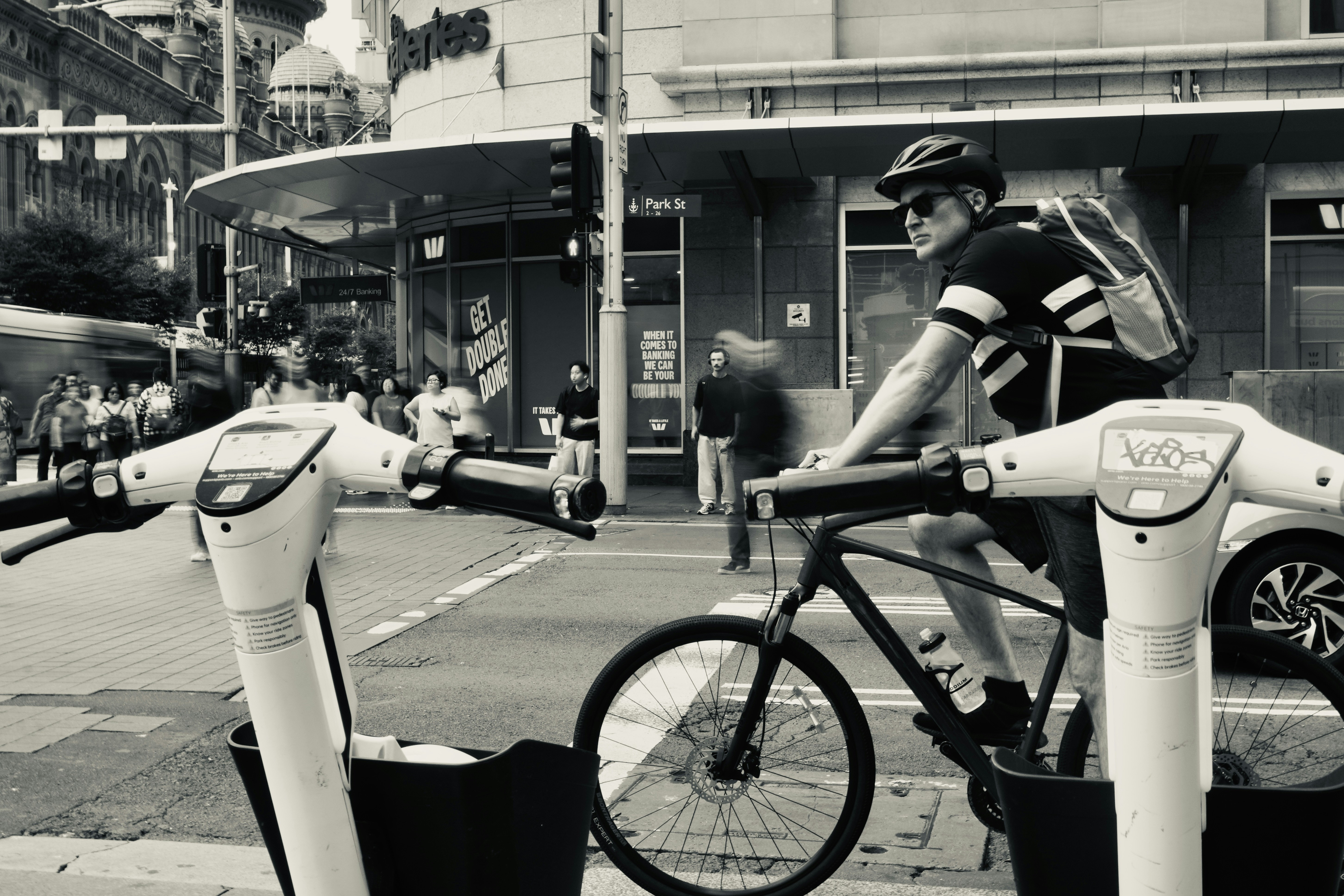 Urban Commute: Cyclist at a Street-side Dock