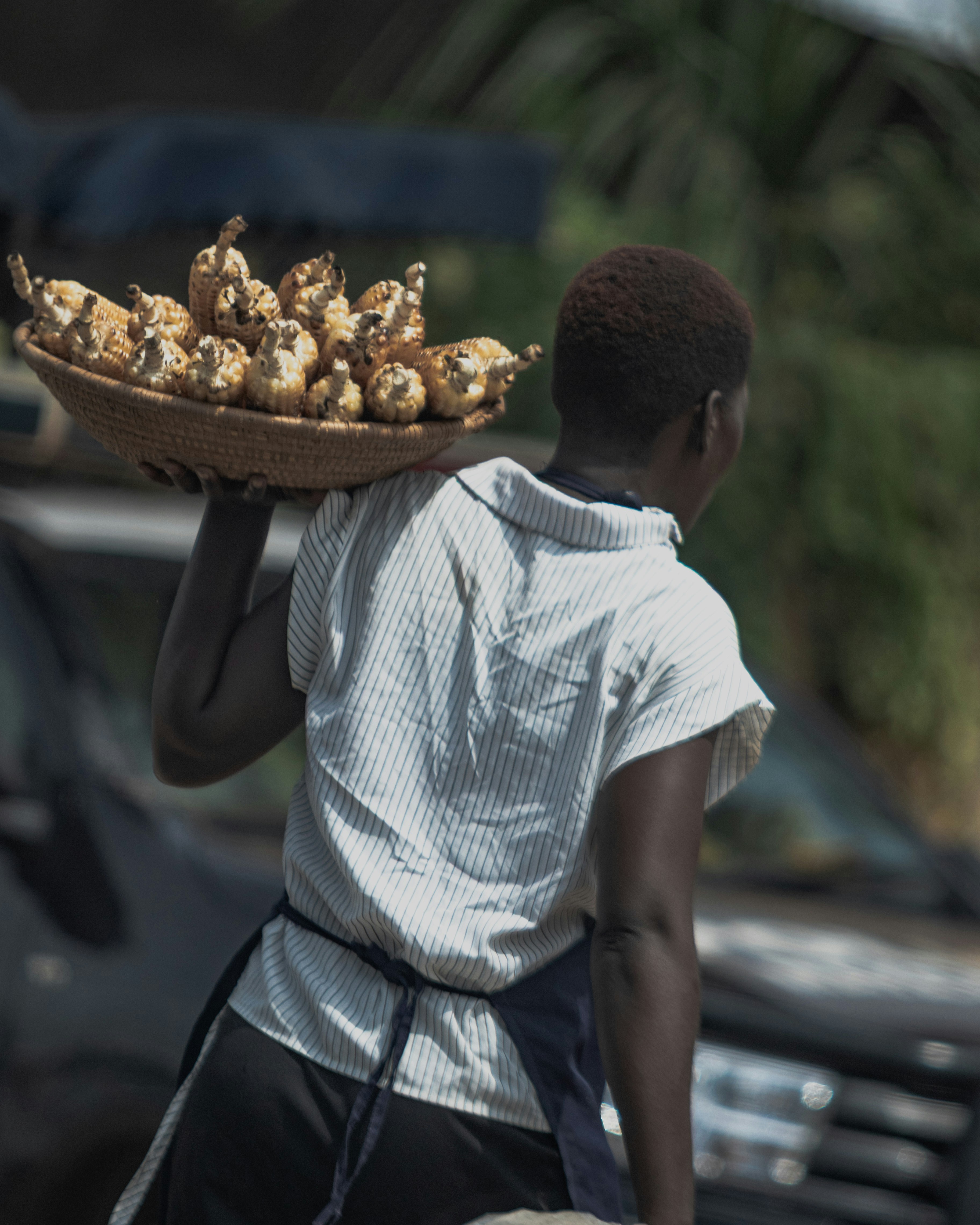Basket of Street Corners: A Vendor Carries Light on The Shoulder