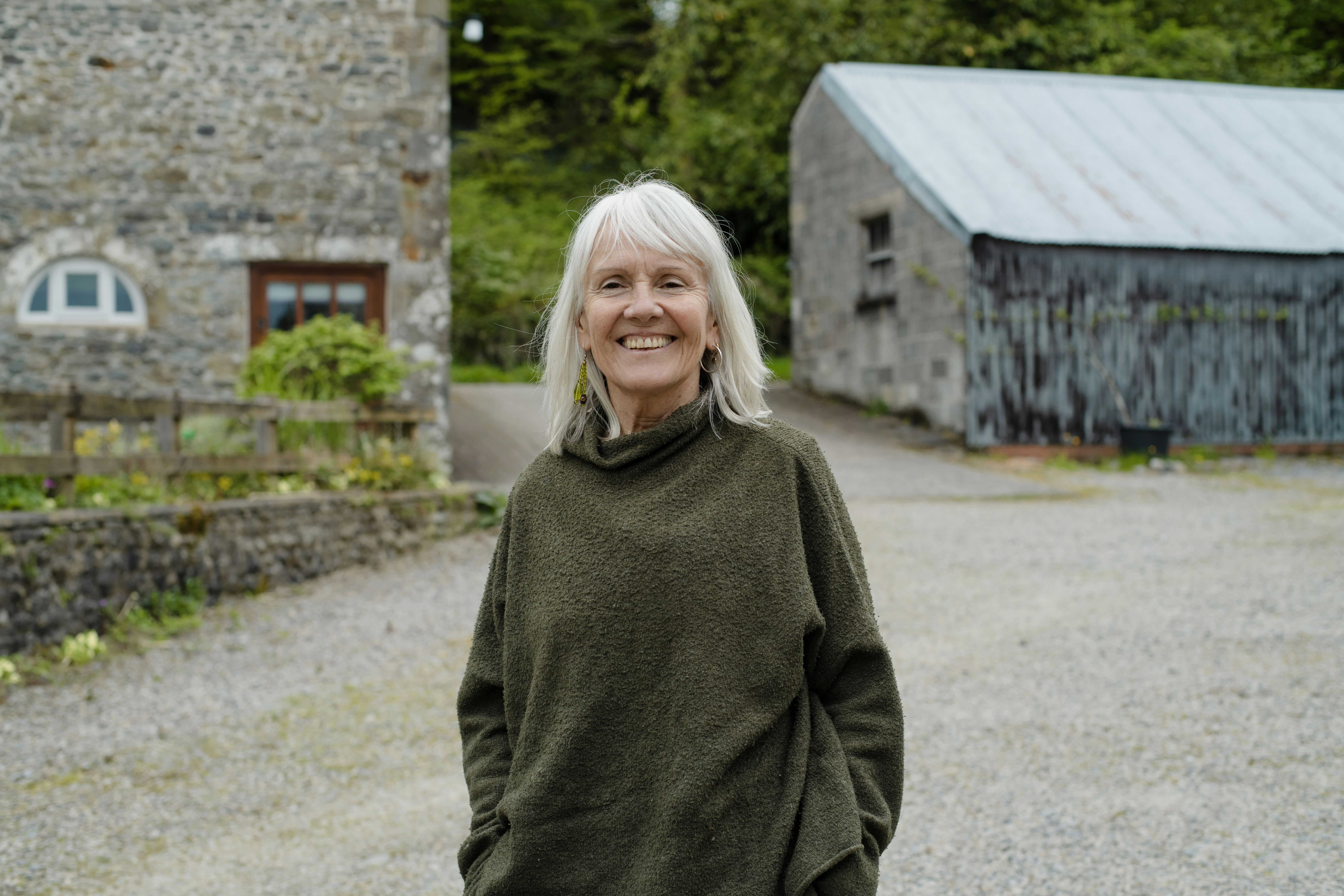 Smiling Gardener on a Quiet Farmyard