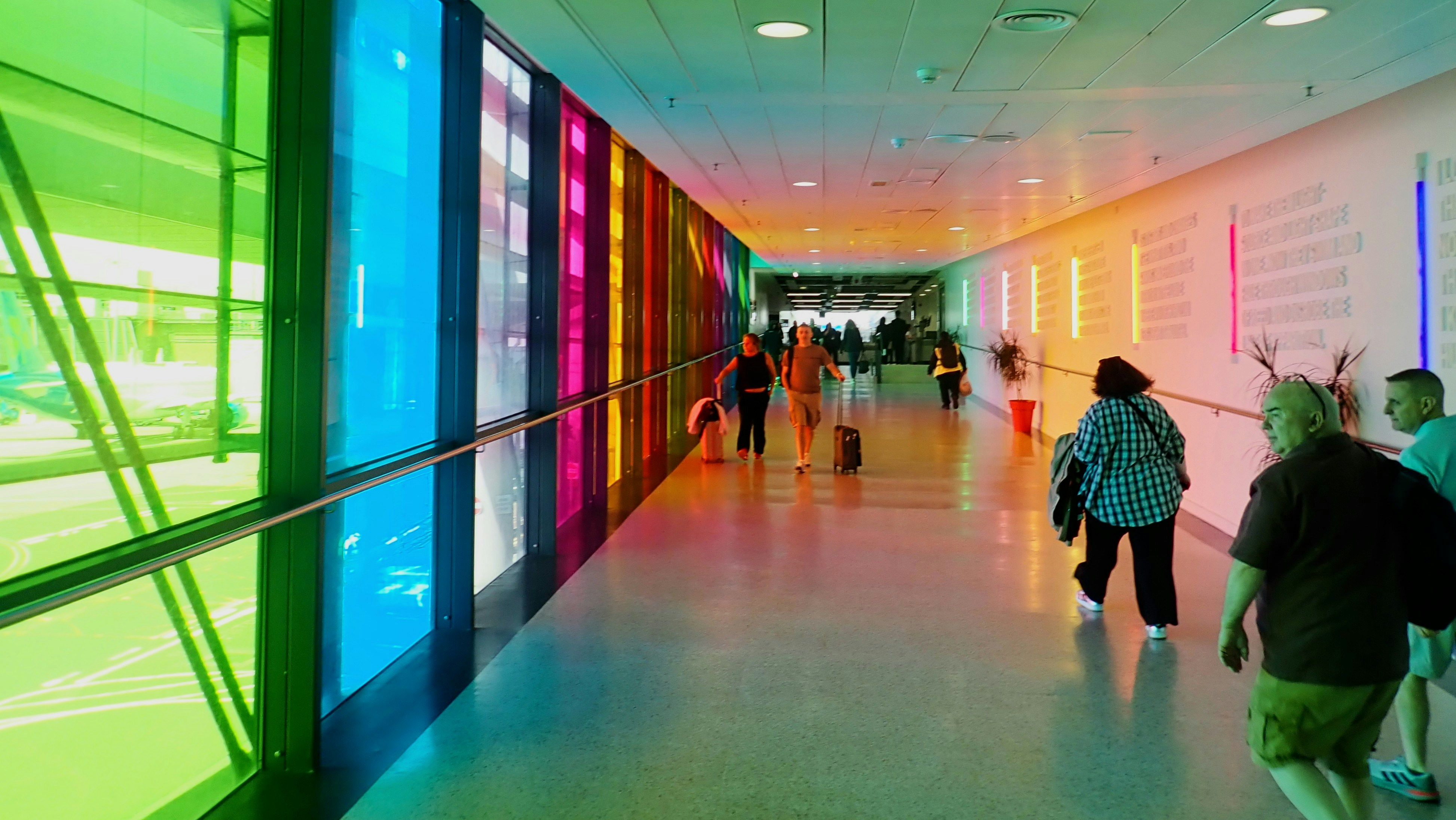 Rainbow Hallway: A Corridor of Lighted Glass Panels