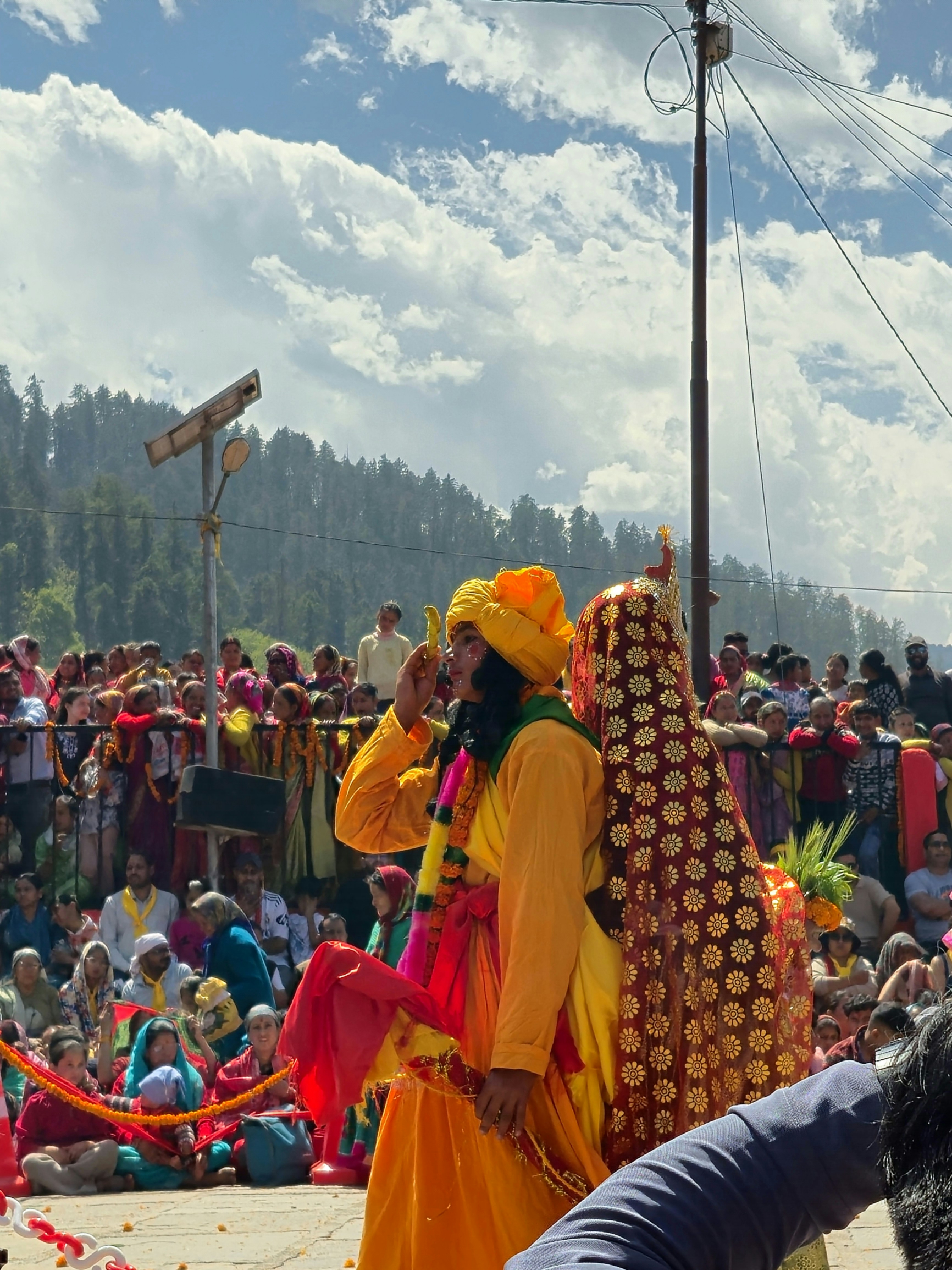 Colorful Ritual in a Packed Outdoor Assembly
