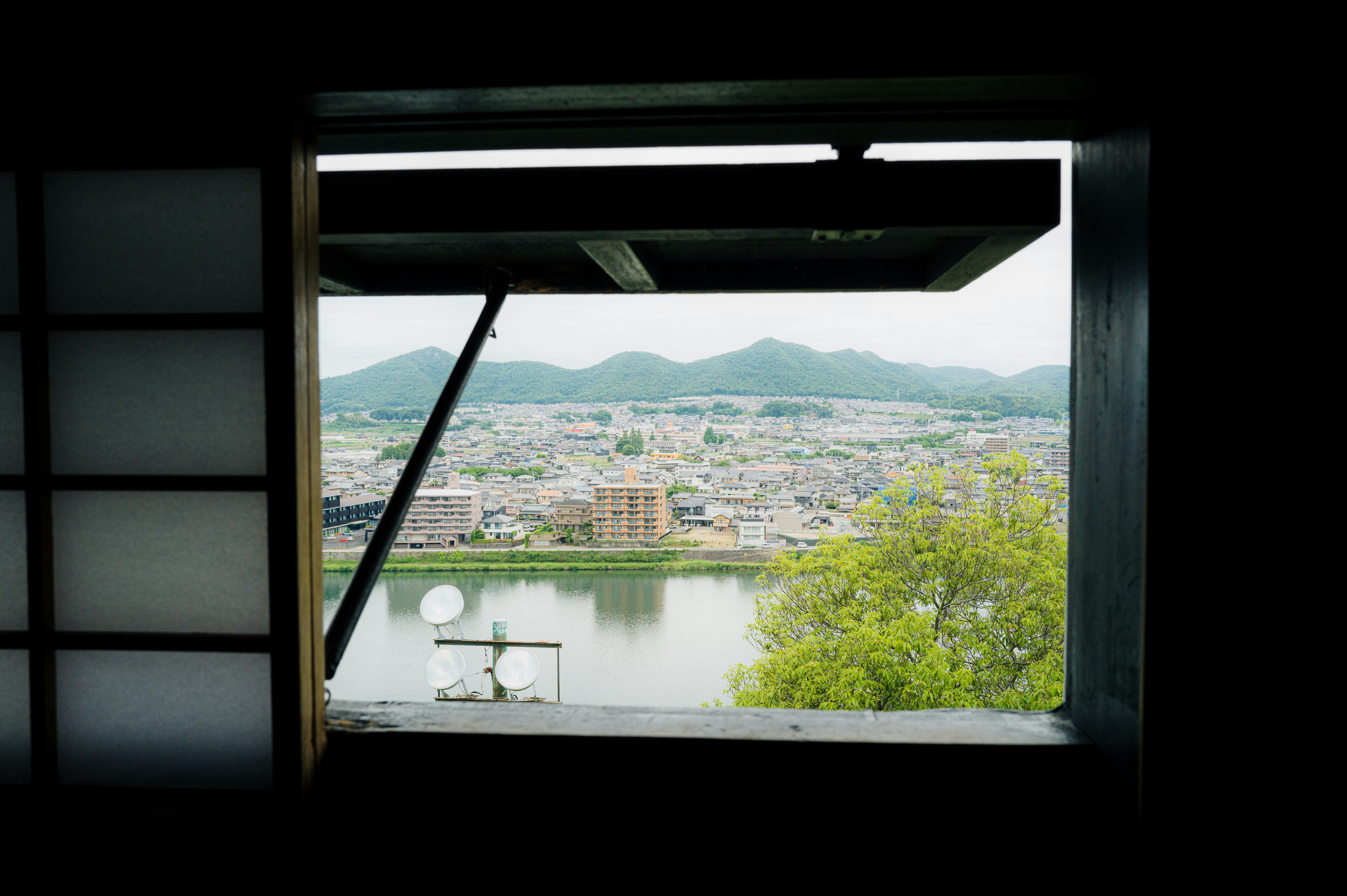 Framed View: A Quiet Village by the River