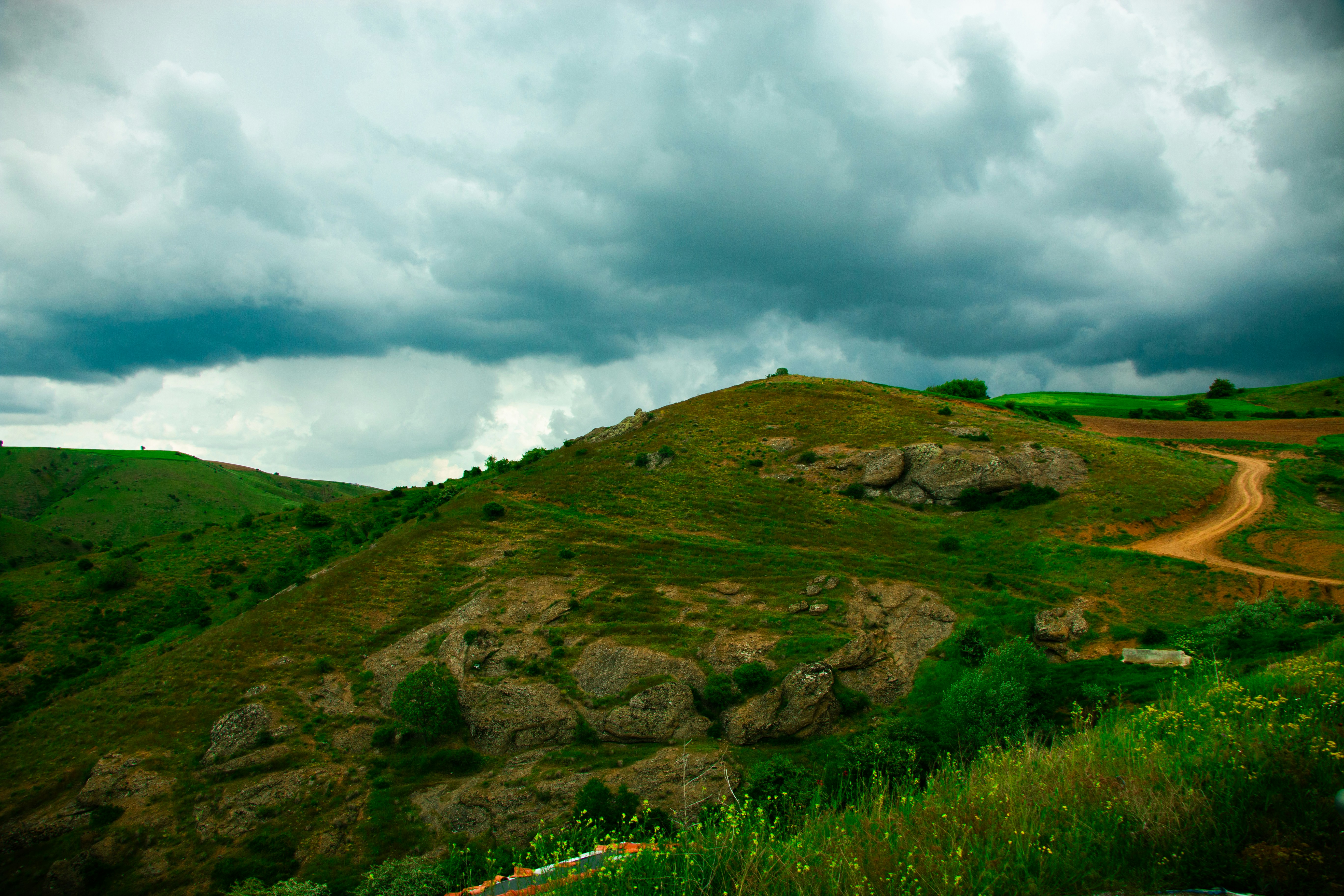 Hilltop Pathway Under A Stormy Cape