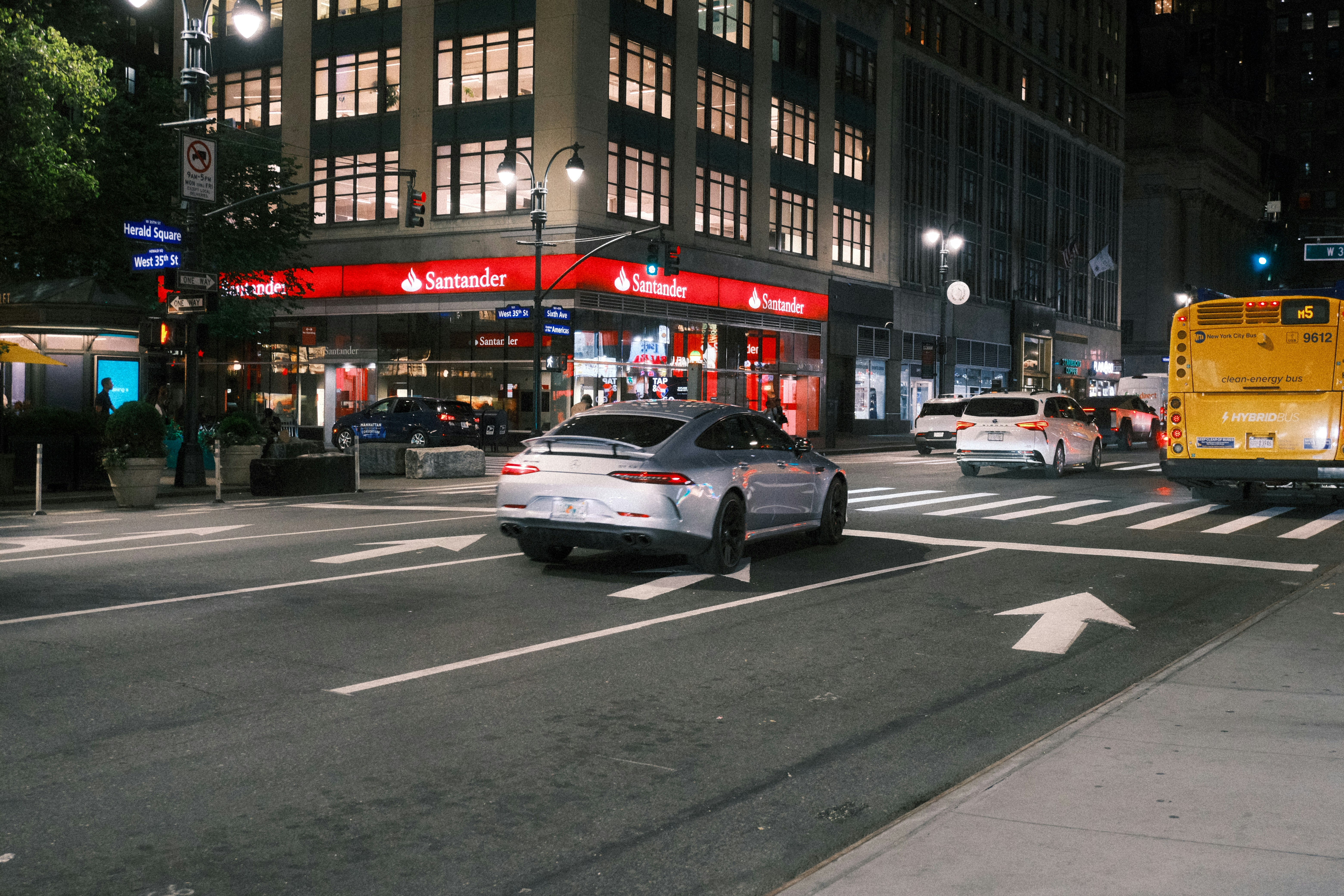 Night Gauge: Midtown Traffic Converges at a Bright Corner