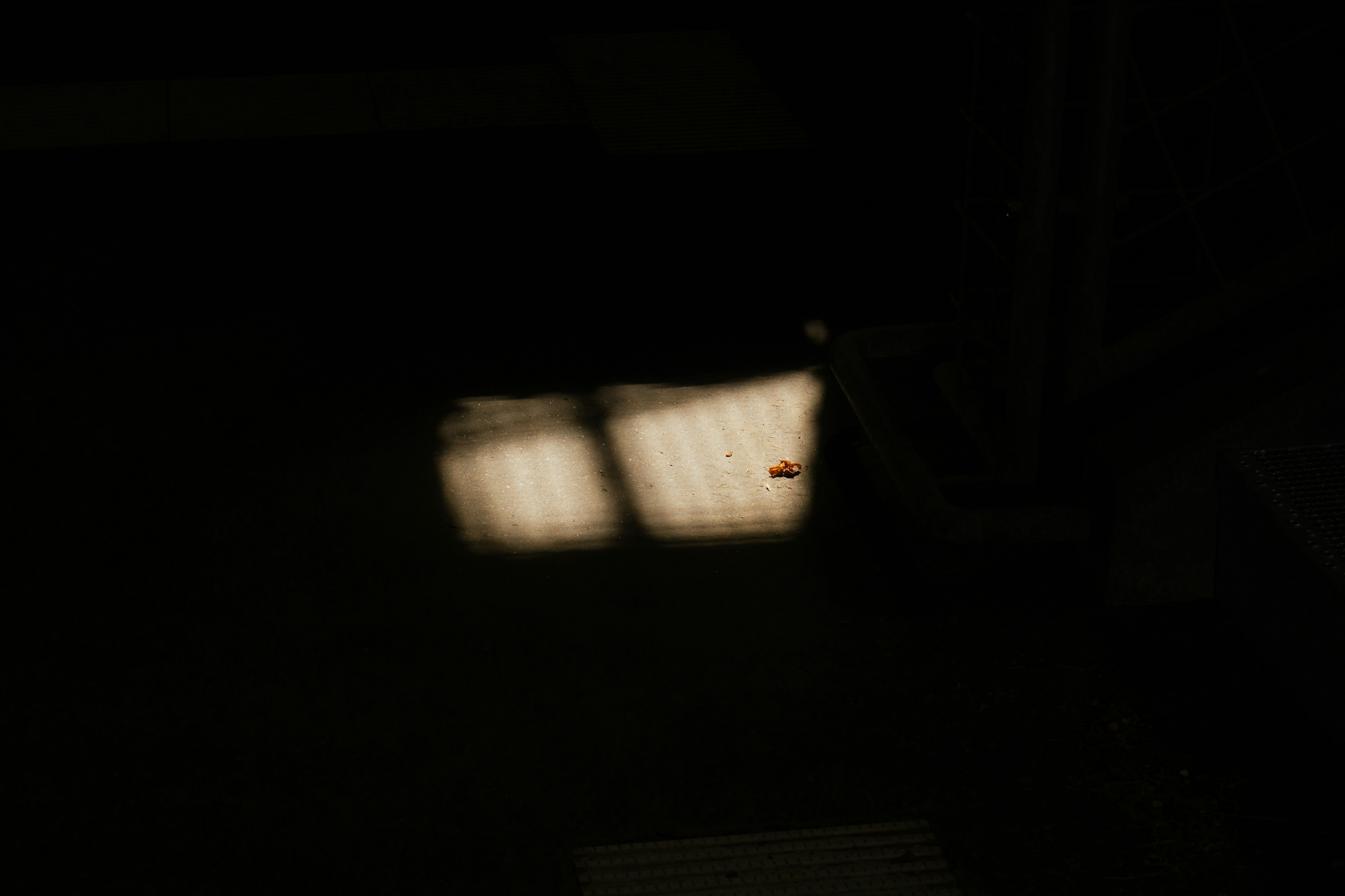 A Single Ember in the Shadowed Stairwell