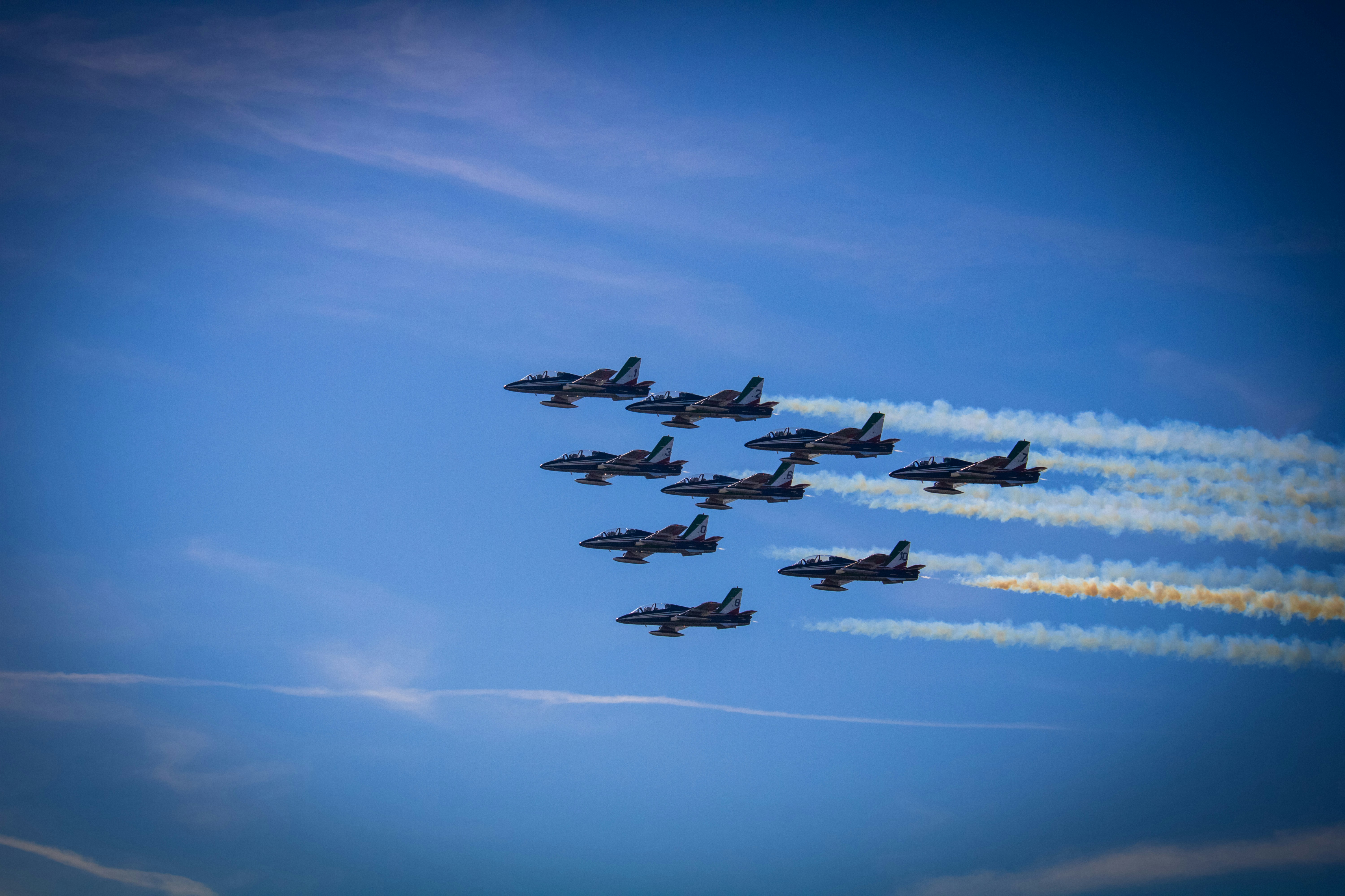 A V Formation in Clear Sky: Jets Carve White Contrails