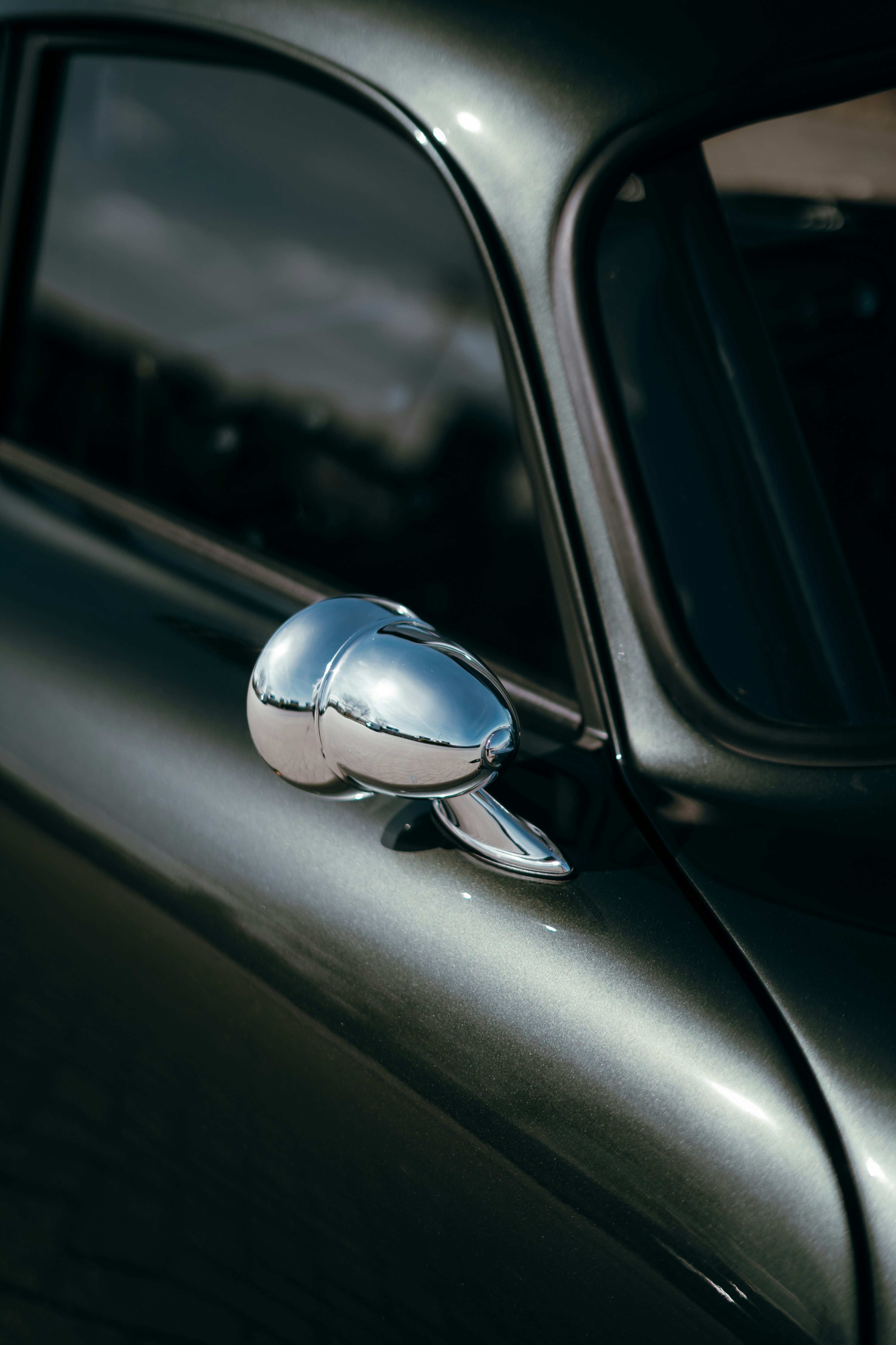 Chrome Mirror, Quiet Steel: A Focus on Classic Car Detail