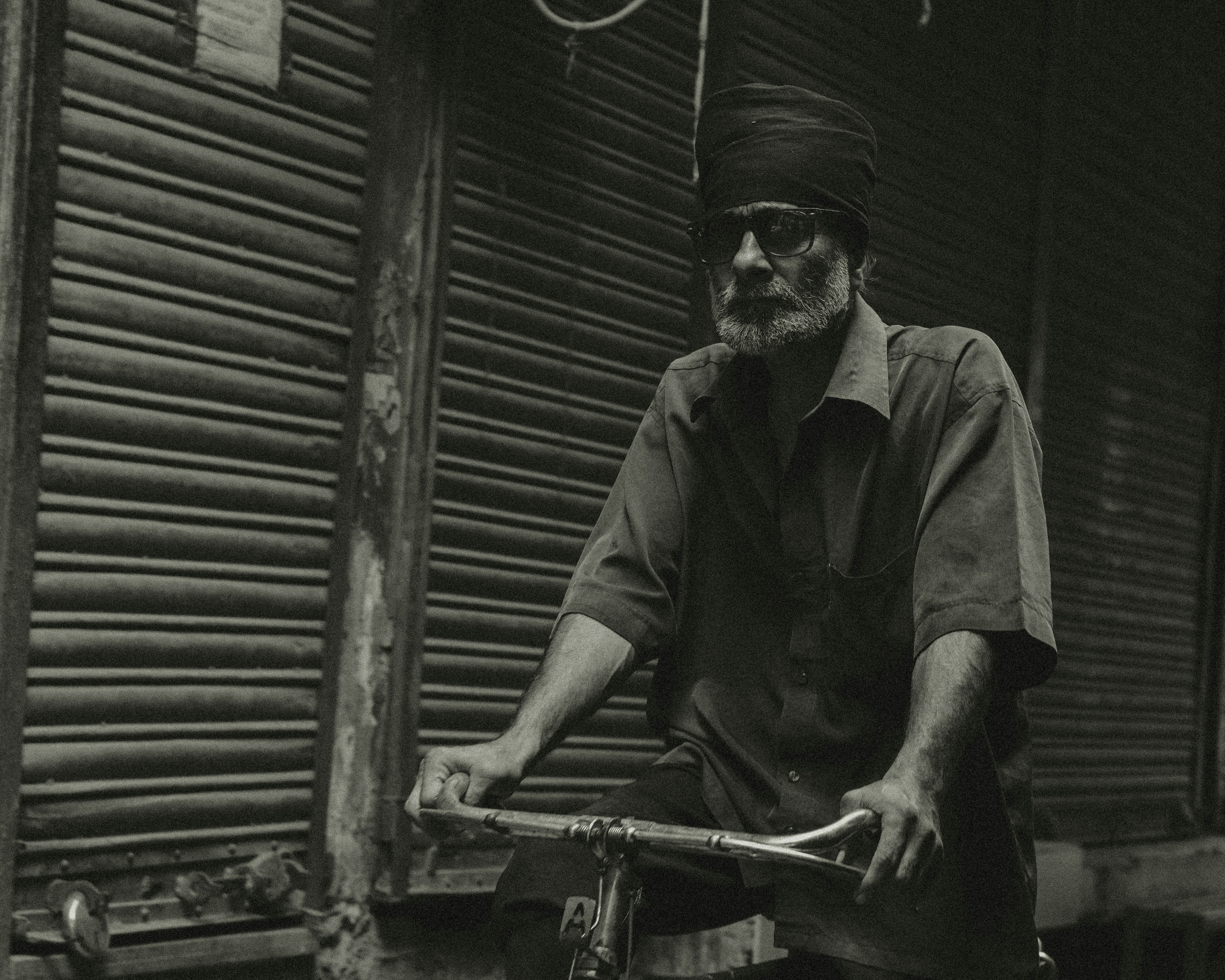 A Weathered Rider in Shadowed Streets