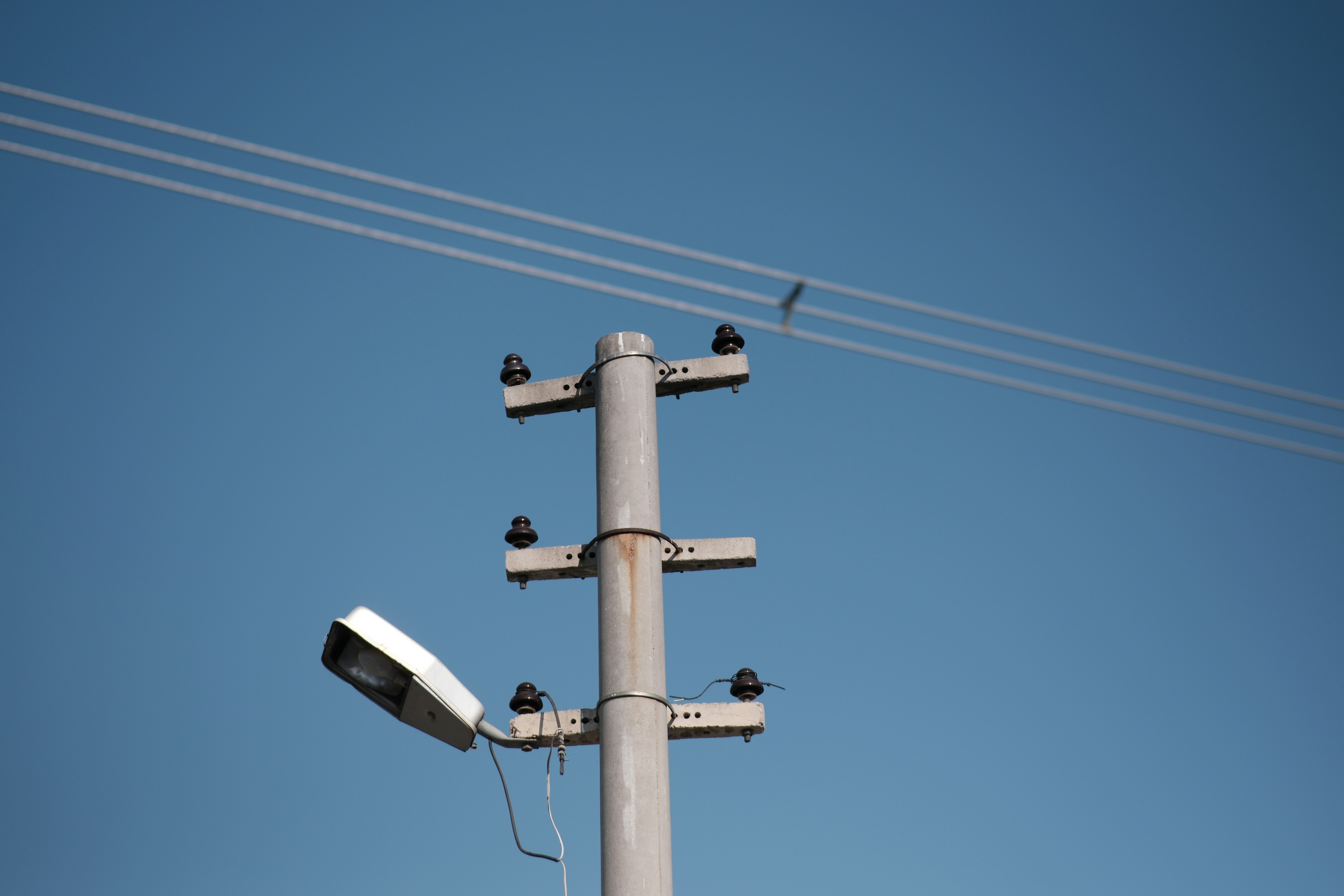 Pole Peak: Utility Luminary Under a Clear Blue Verve