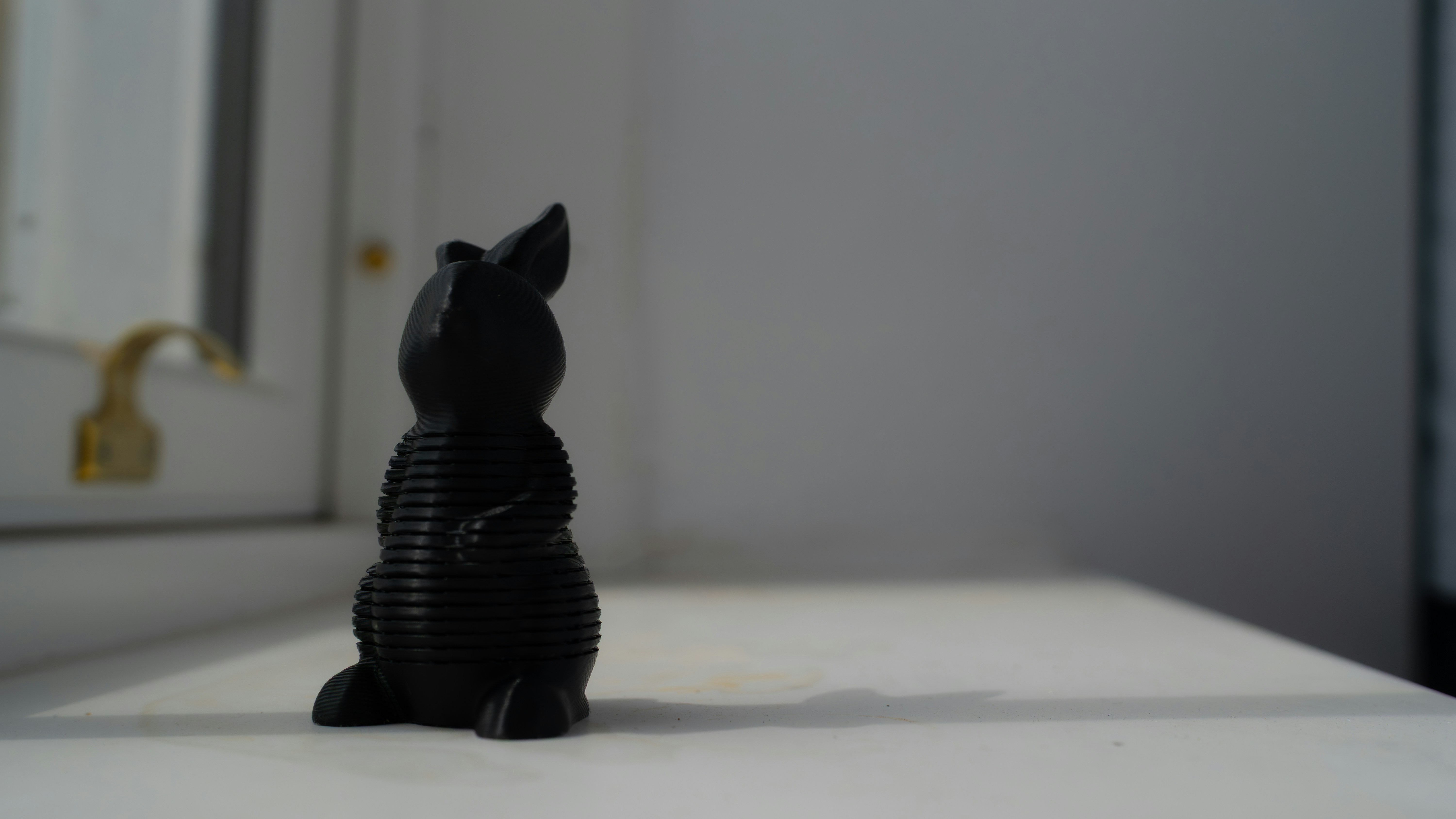 Silent Cat on a White Desk