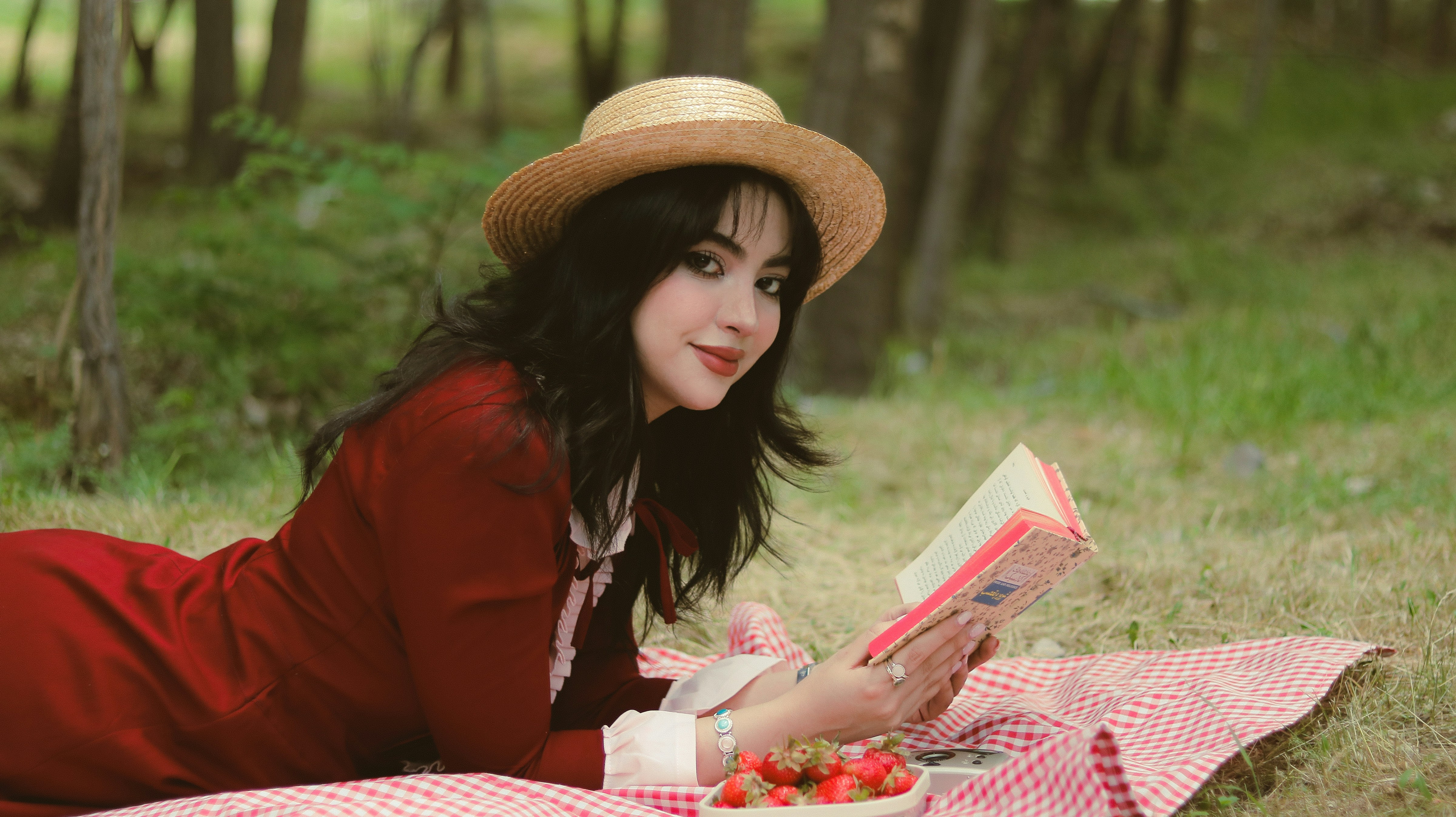 Portrait in a Sunlit Meadow: A Reader in a Straw Hat