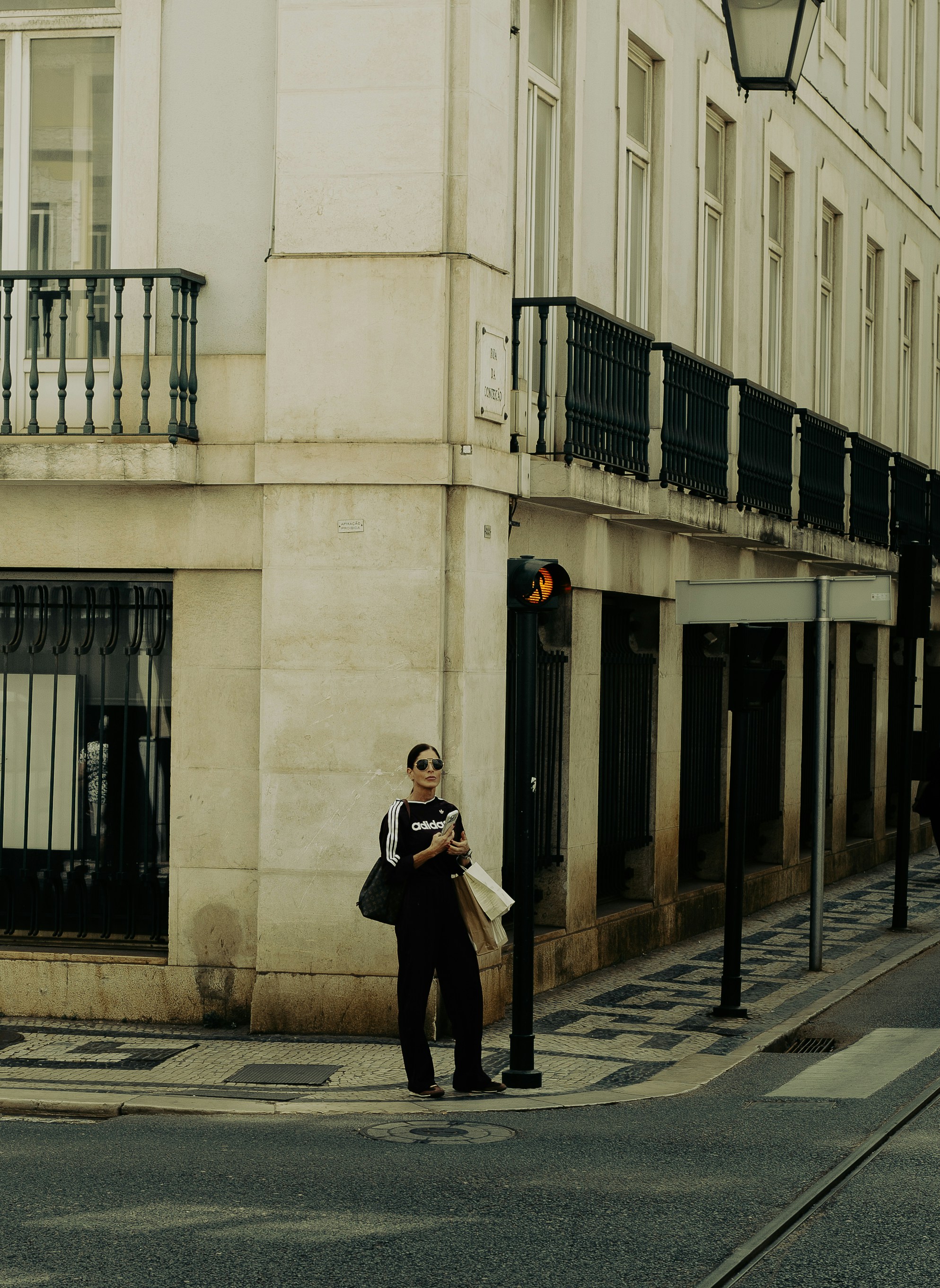 City Corner Portrait: A Quiet Moment by the Stone Facade