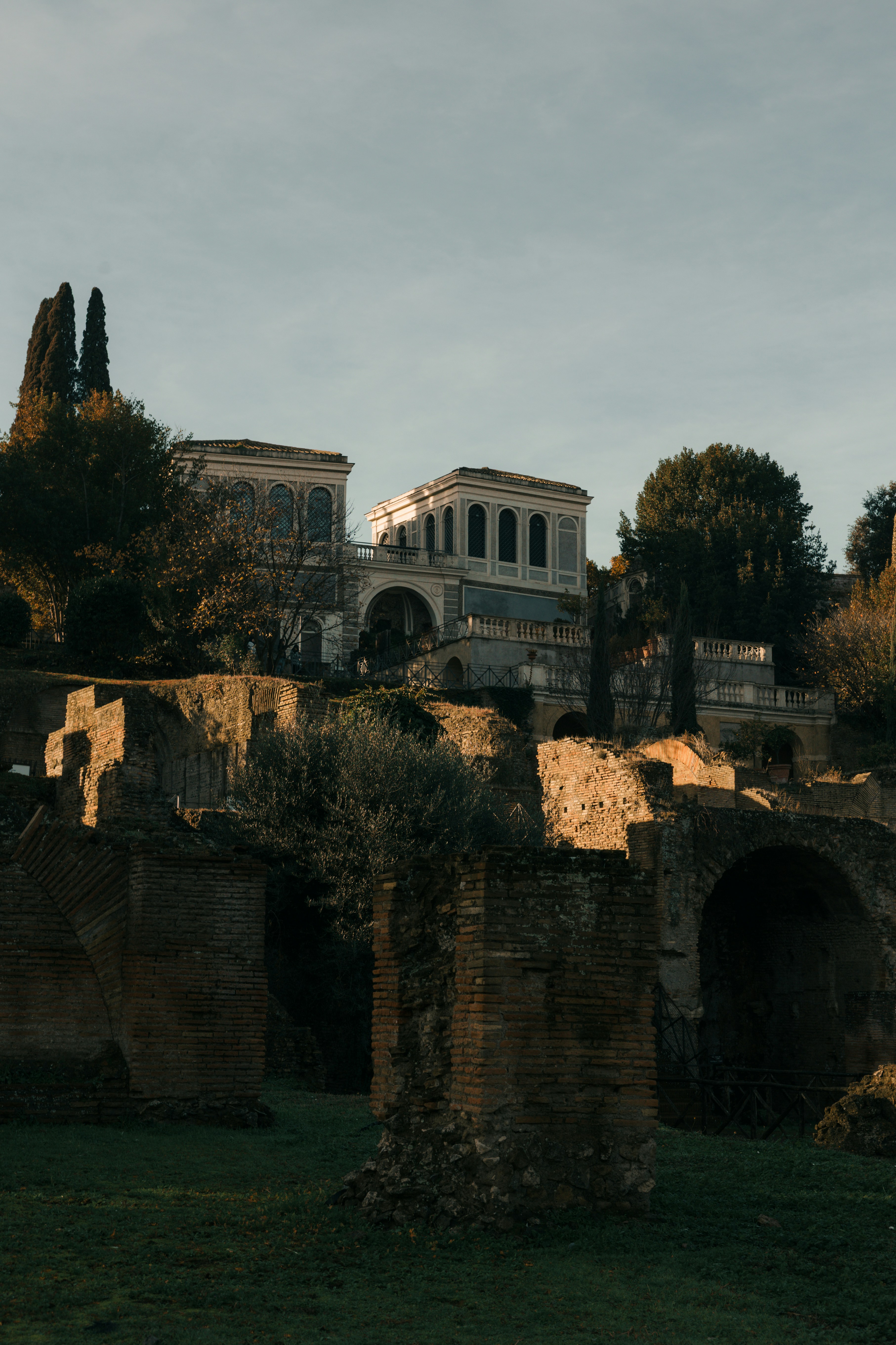 Ancient Ruins and a Classical Facade perched over sunlit arches