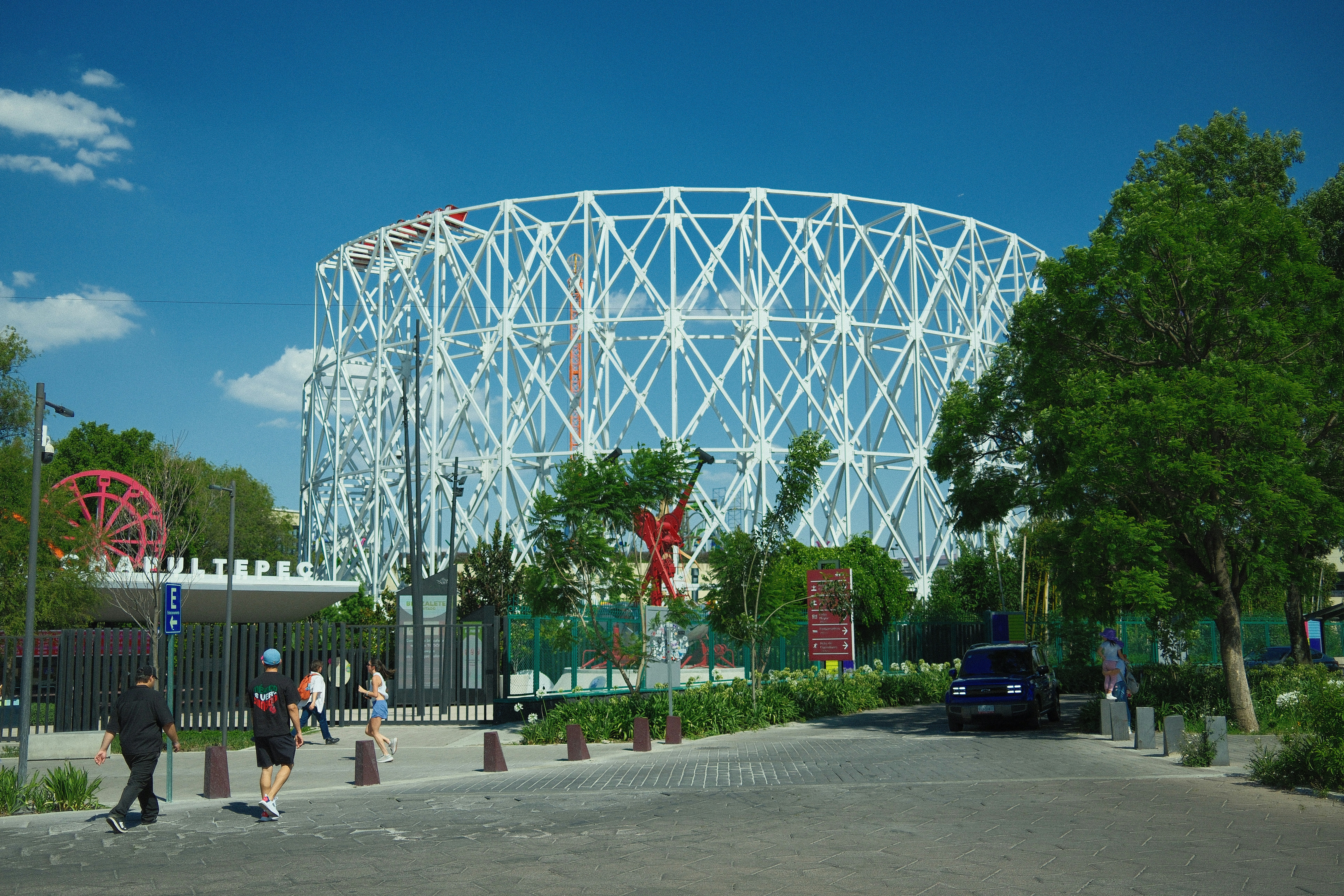 Crisscrossed Steel Veil: A Modern Arena Rising Over the Street