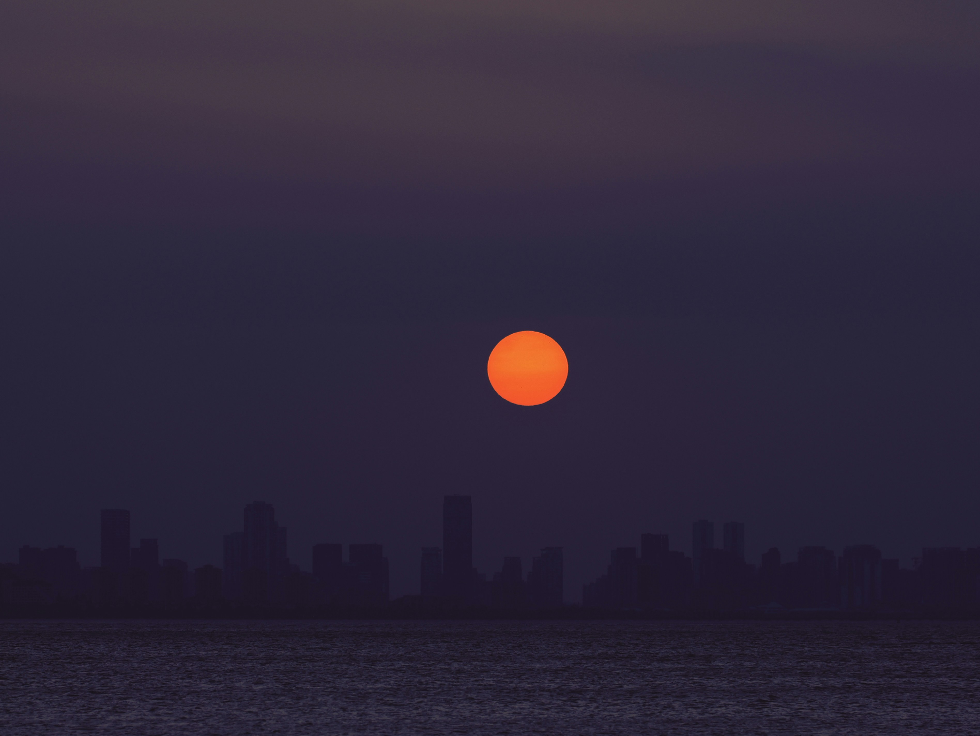 Orb of Dusk Over a Silent Skyline