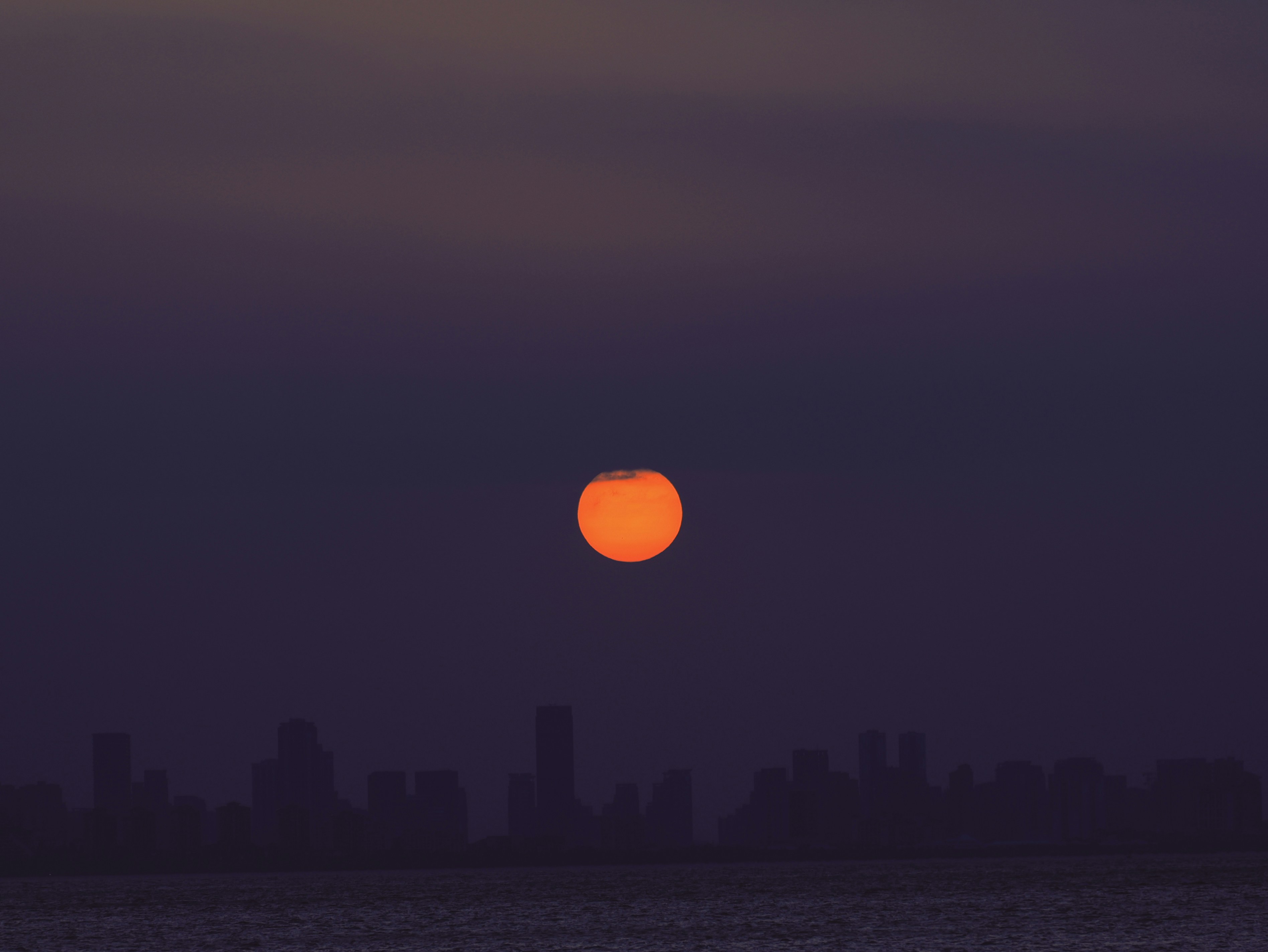 Sunlit Ember Above the Quiet Horizon