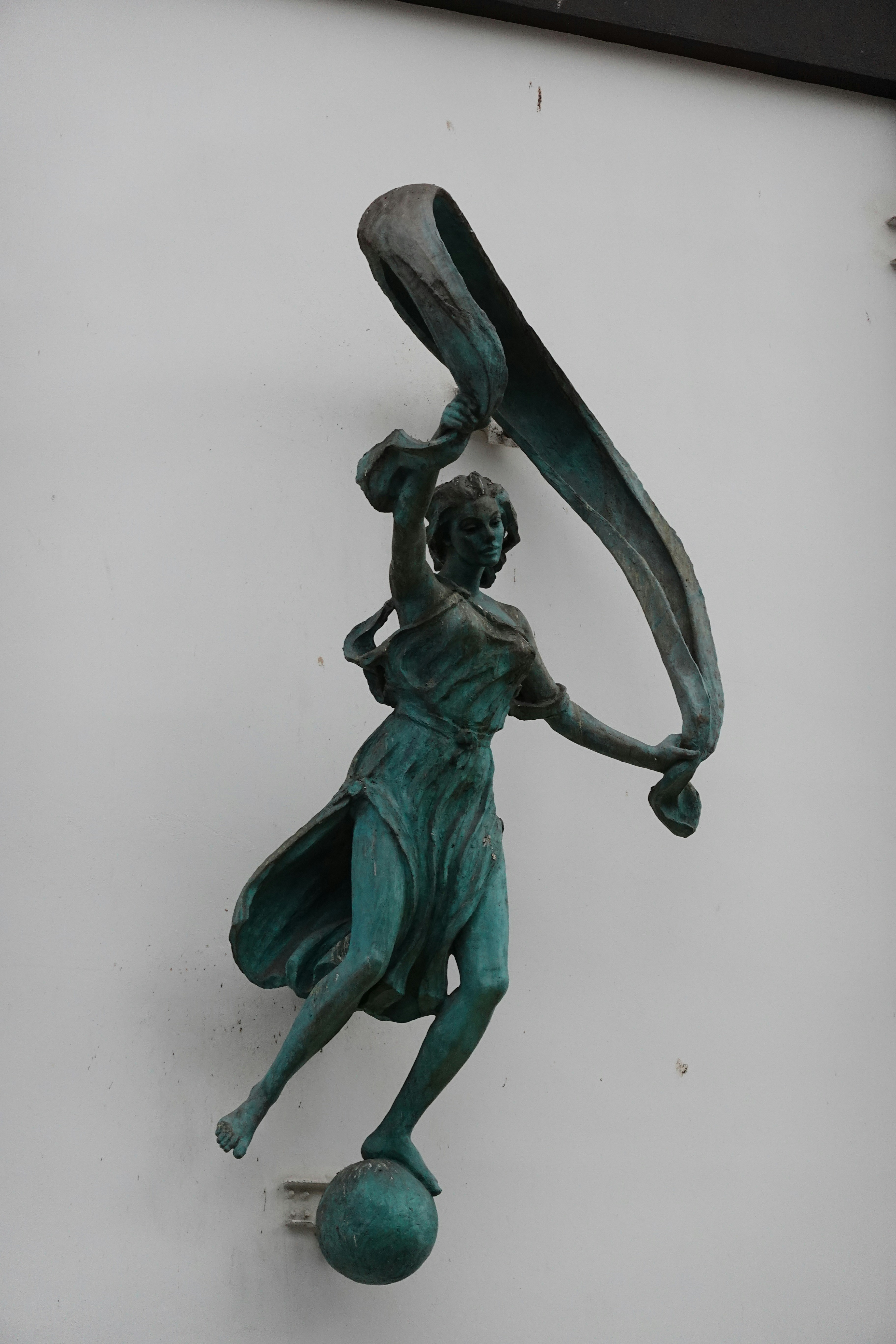 Bronze-Patina Warrior Wielding a Ribboned Blade