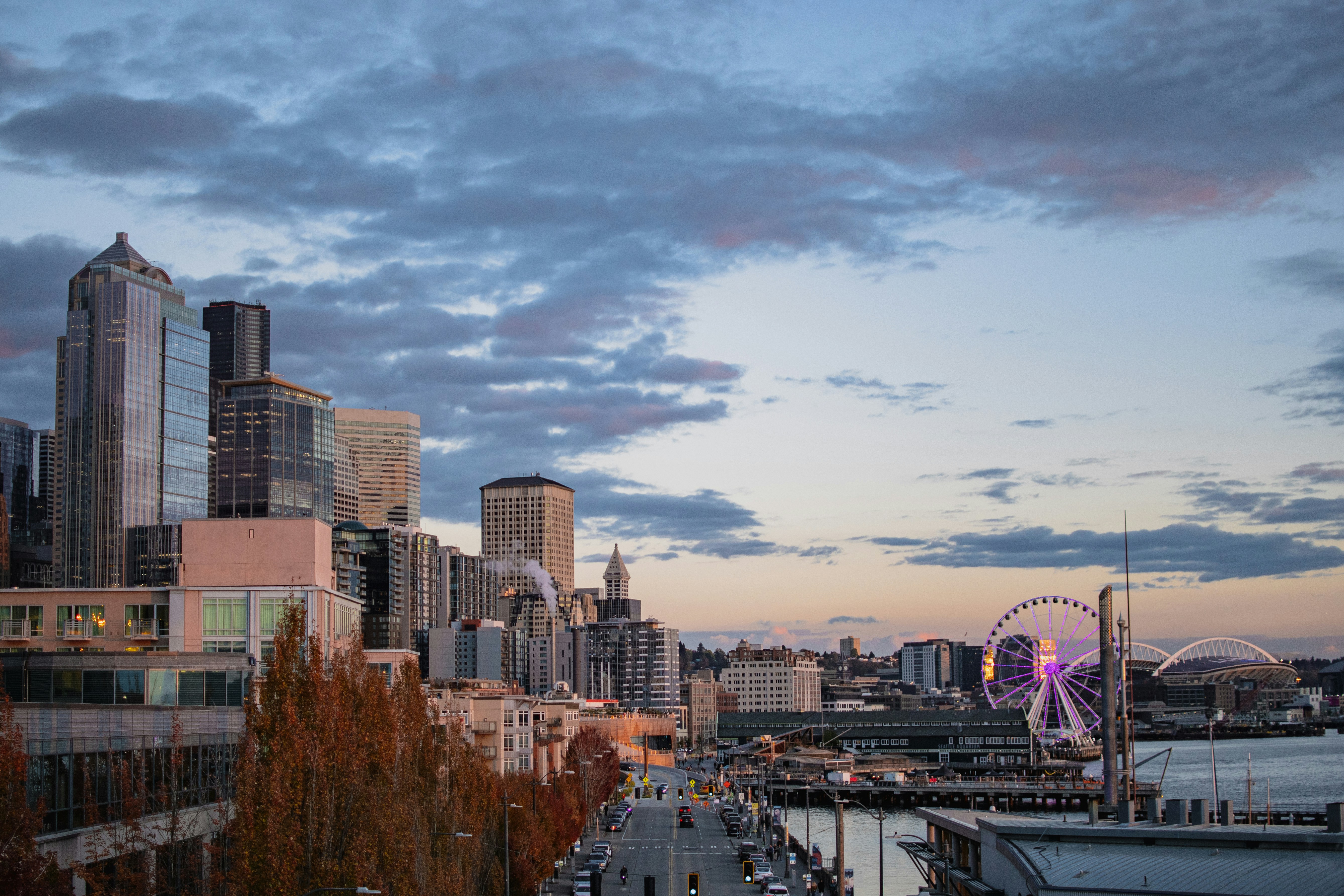 Dusk Over Seattle Waterfront: Skyline, Ferris Wheel, and Marina Lights