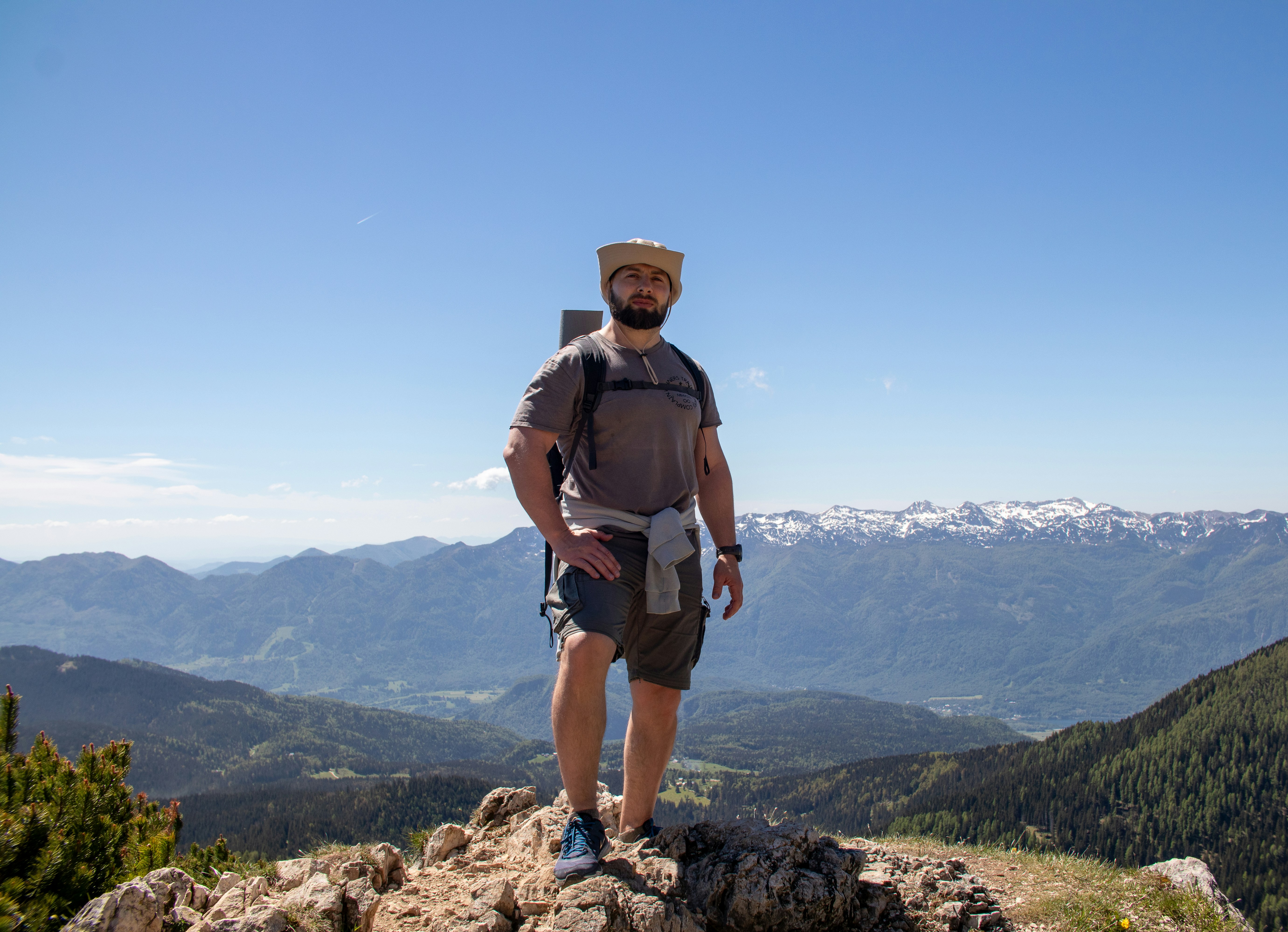 Summit Portrait: Man Standing on a Rocky Vista