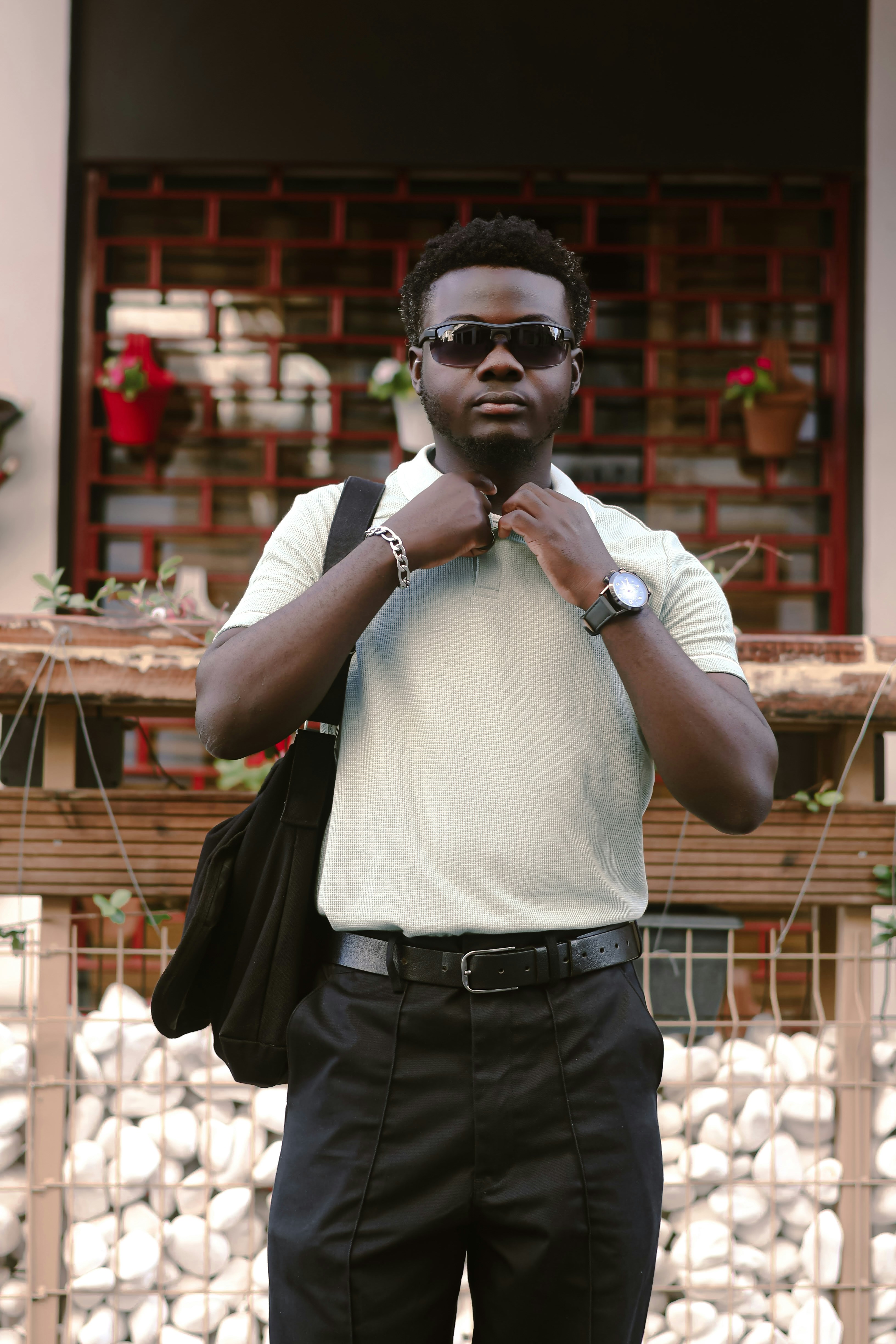Confident Moment: Portrait of a Dapper Young Man with BackpackBar