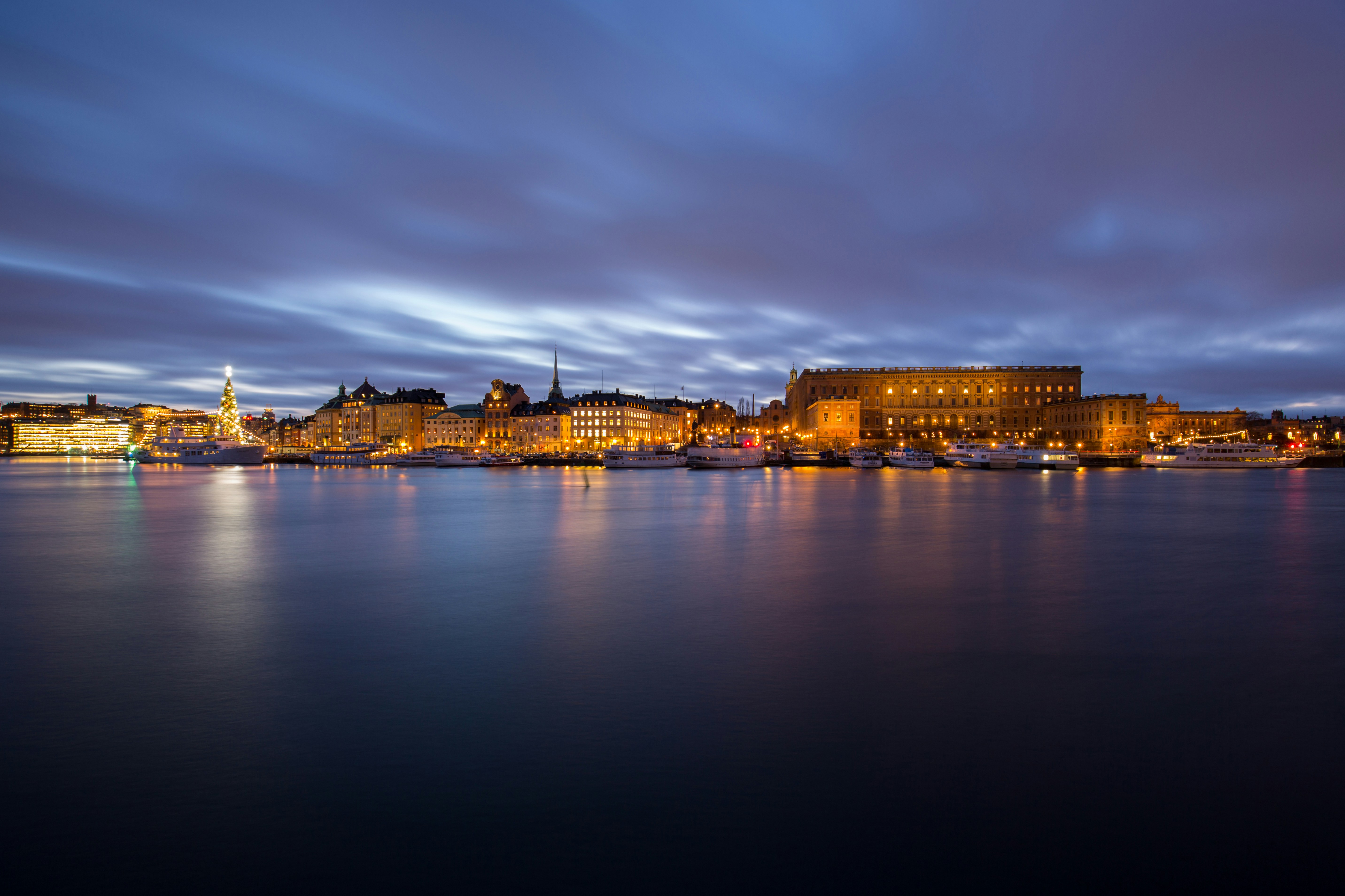 City Lights on Calm Waters: A Long-Exposure Riverside Night