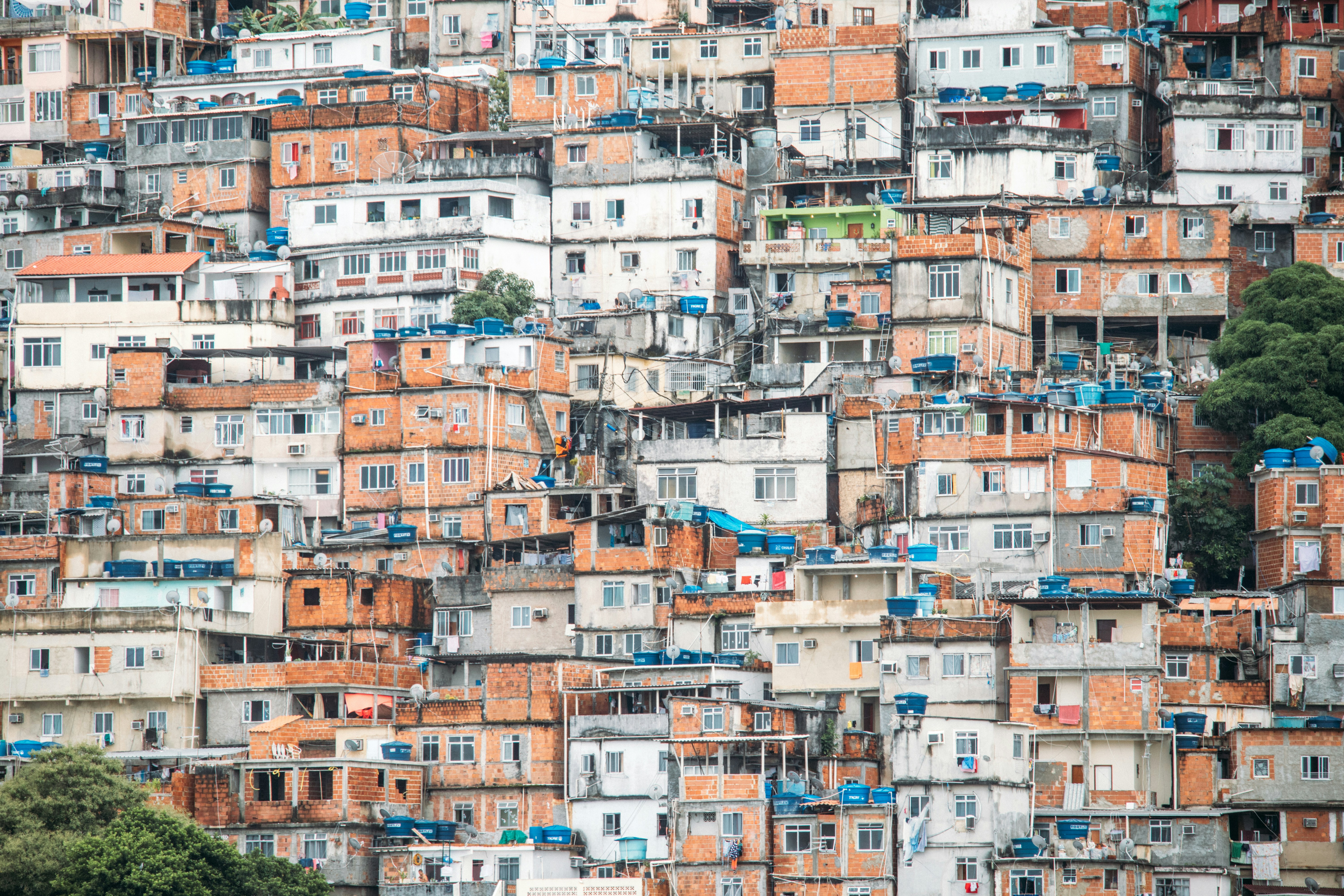Densely packed favela houses on a hillside.
