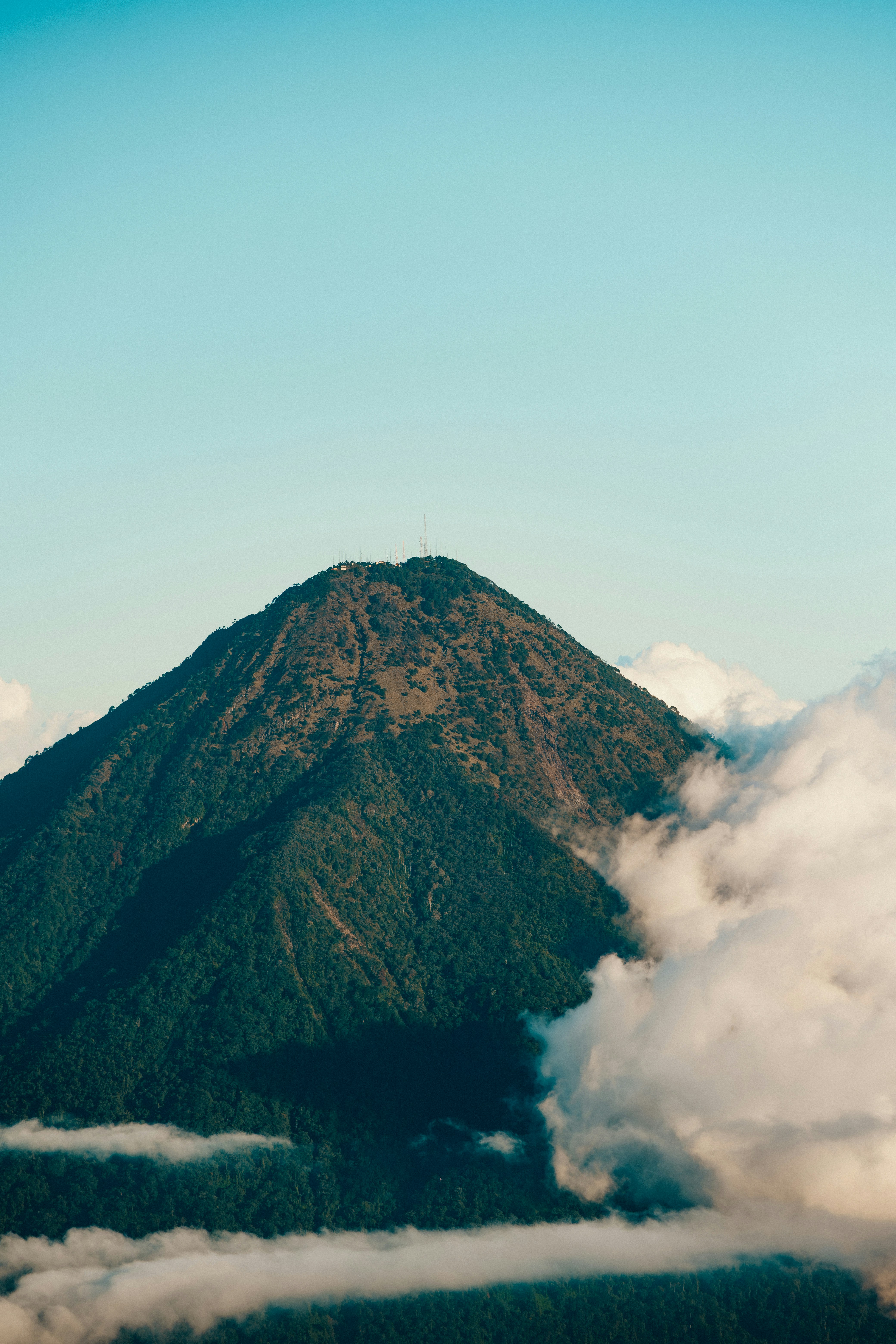 Summit Sentinel: A solitary peak bathed in dawn light