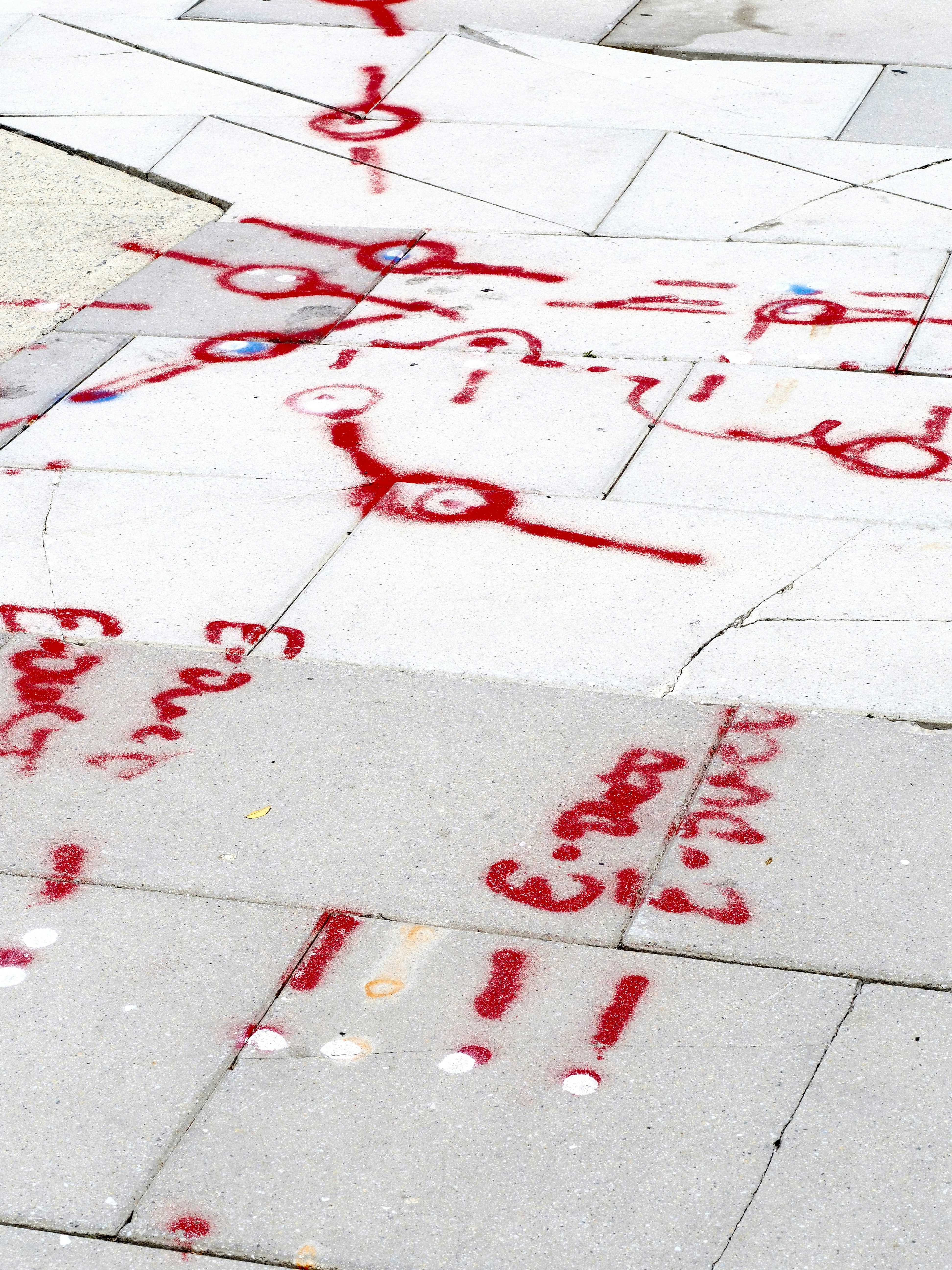 Red Chalk Glyphs on Pale Pavers: Traces of Street Markings