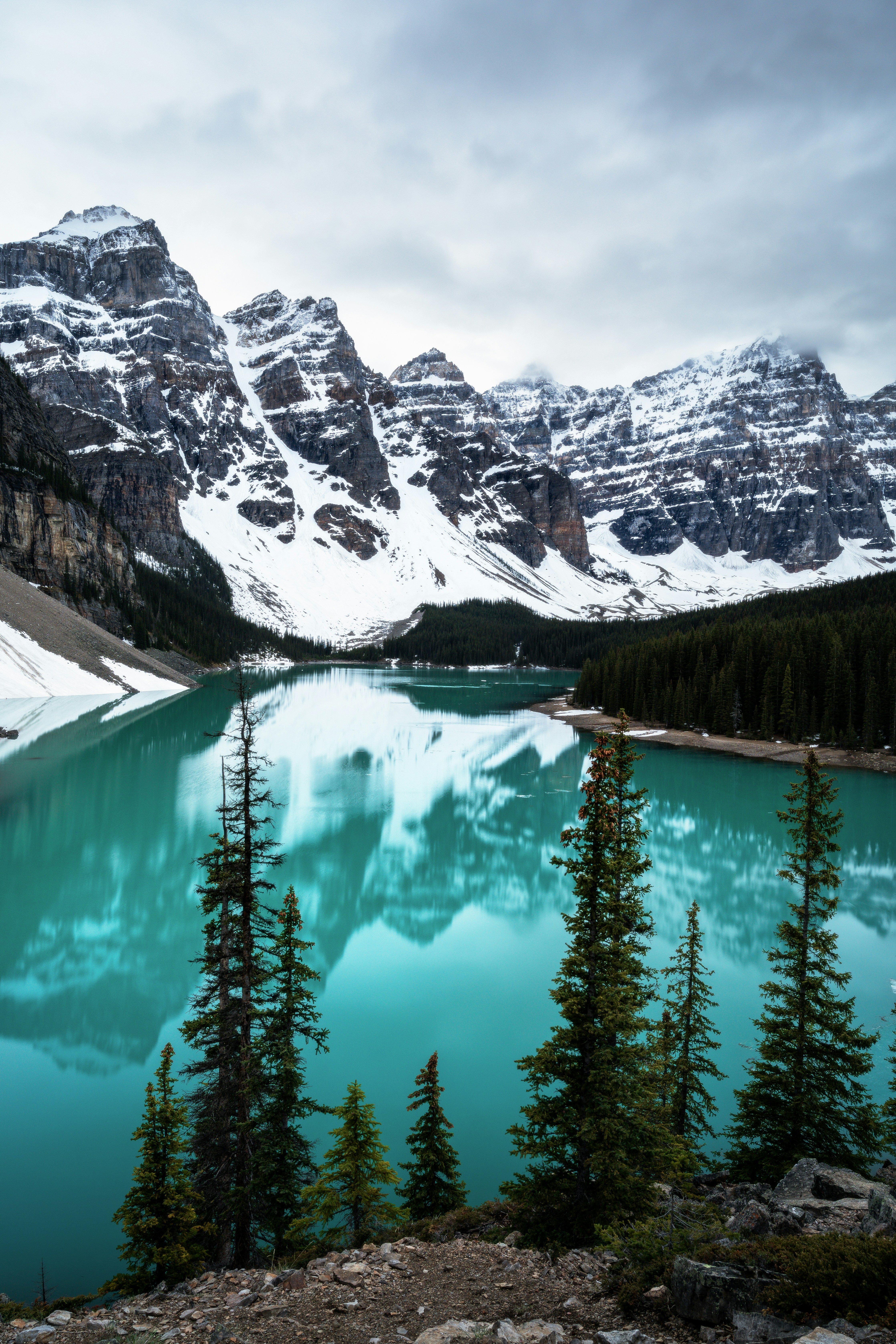 Emerald Mirror: Snowy Peaks Framed by Turquoise Glacier Lake