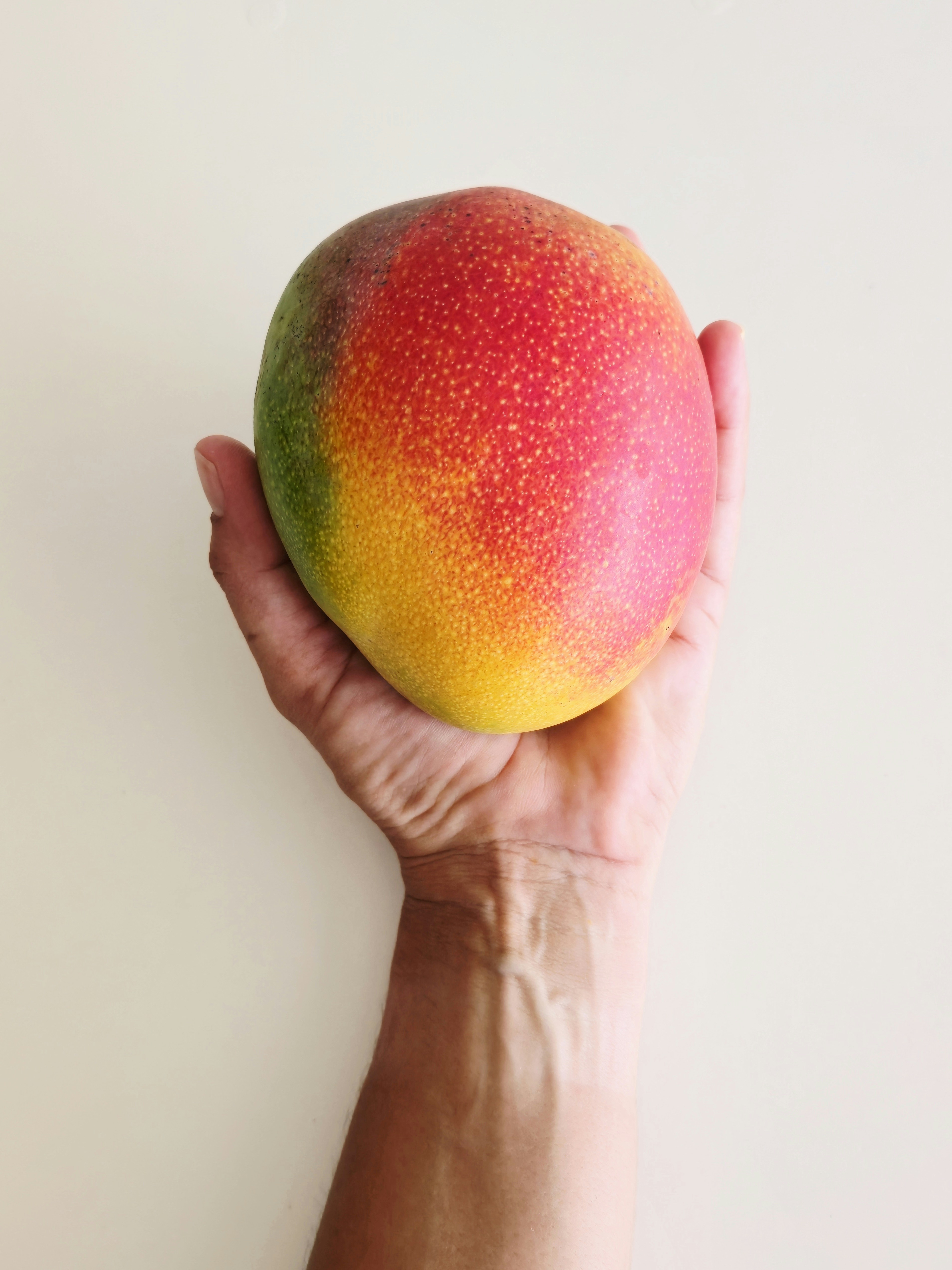 Mango in hand: a study of color, grip, and calm