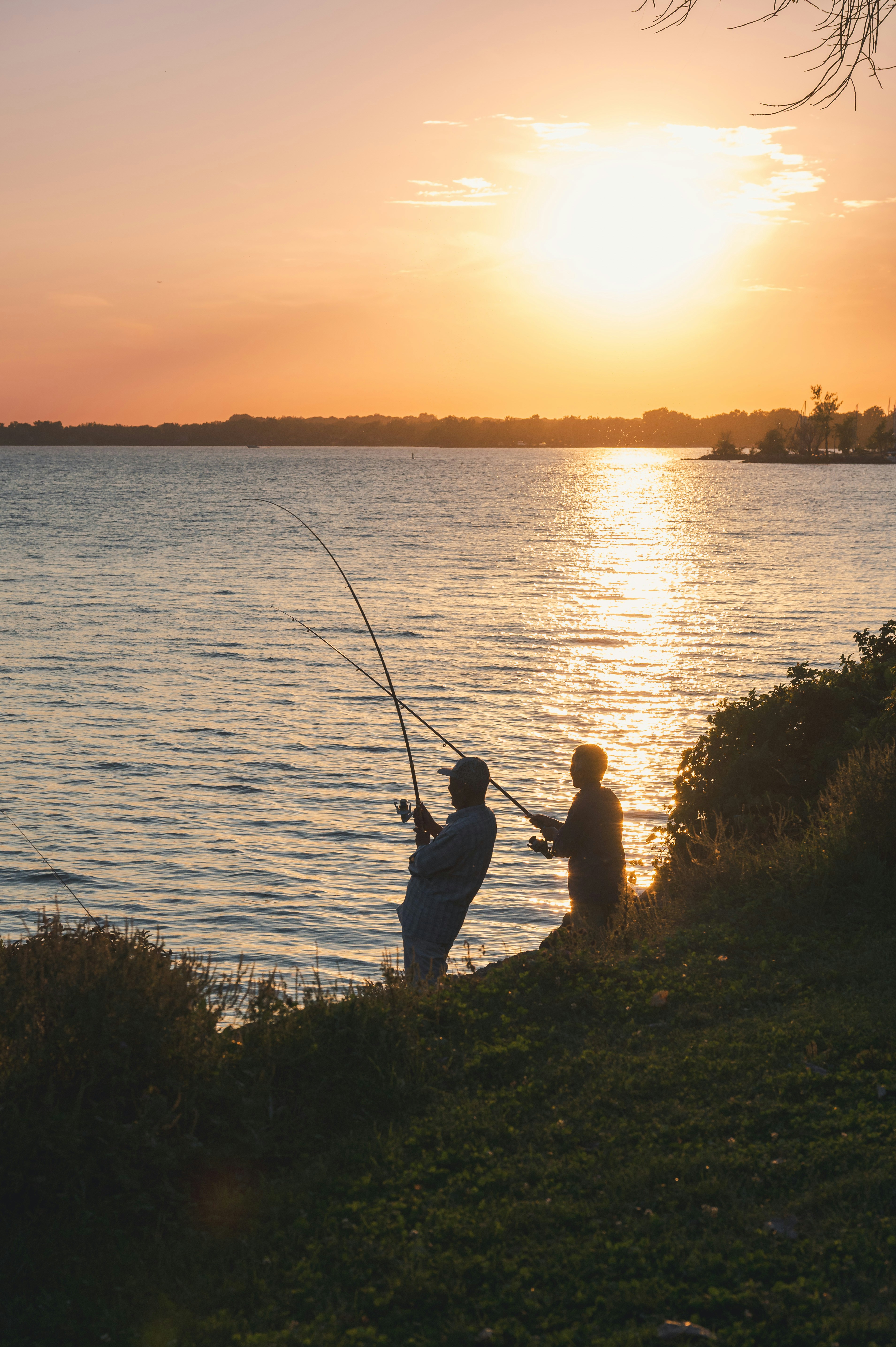 Sunset Rods: Two Anglers in a Golden Bend