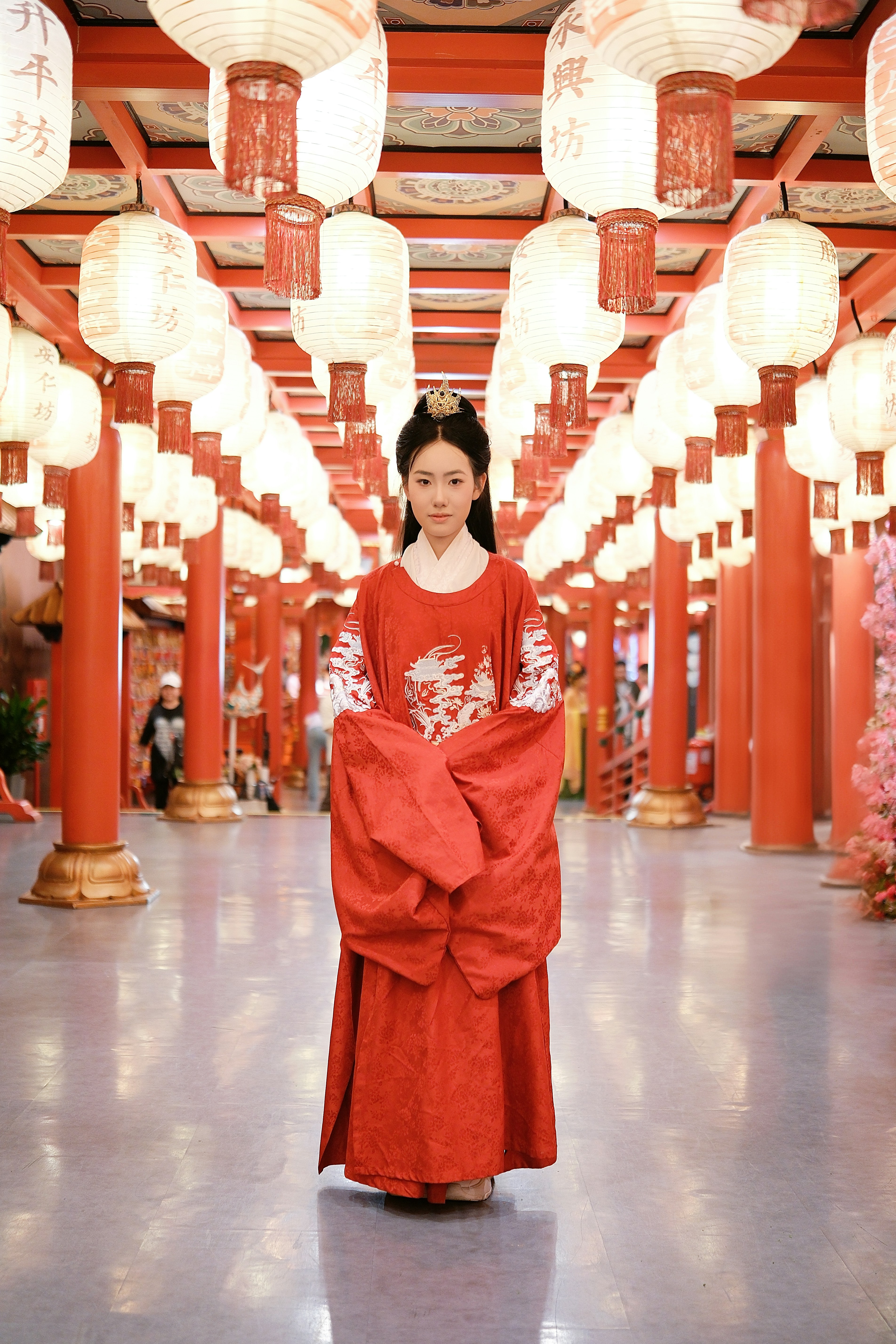 Red-robed Serenity: A Quiet Portrait Under Lantern Sea