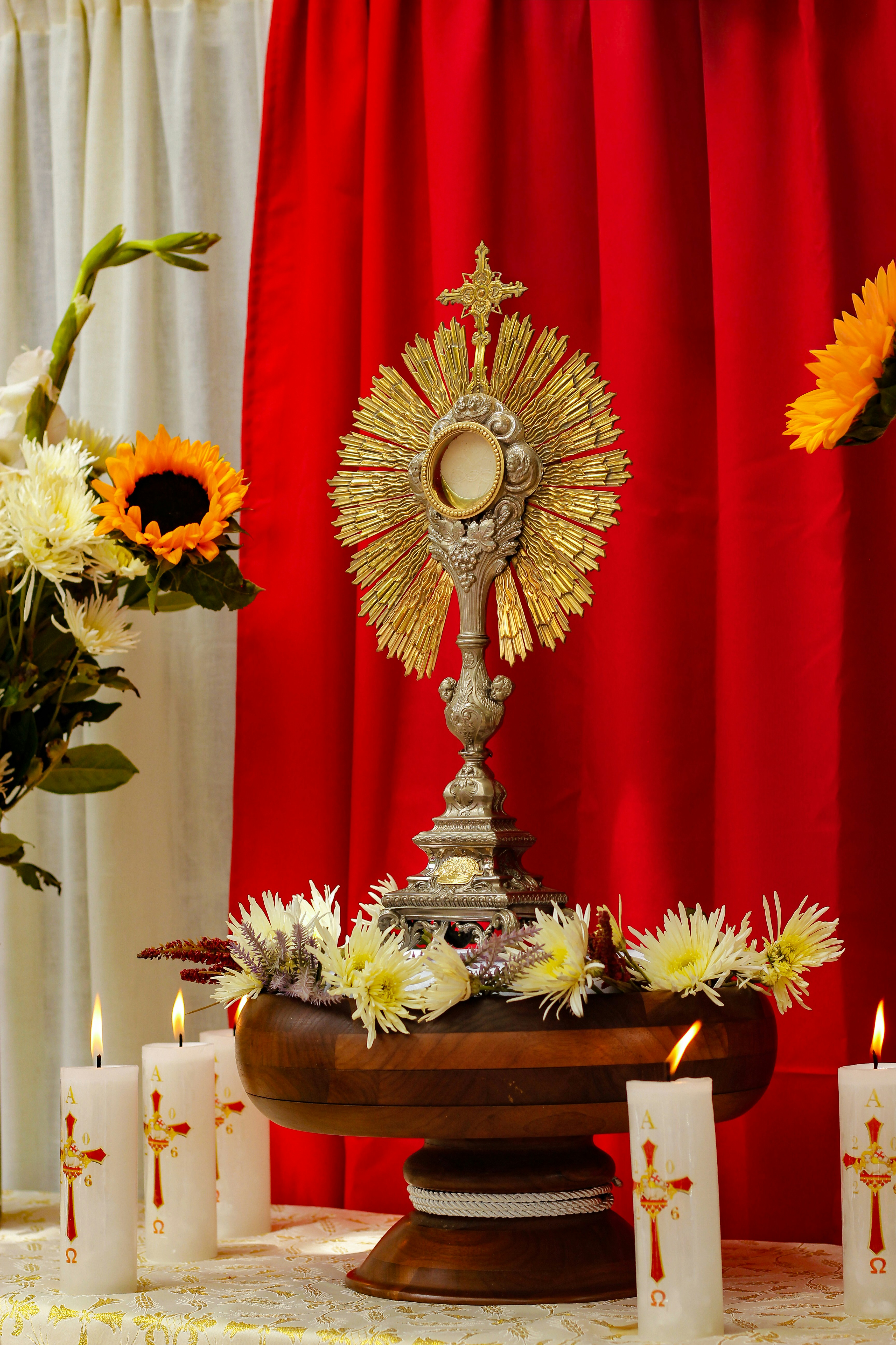 Radiant Reliquary Amid Crimson Drapery