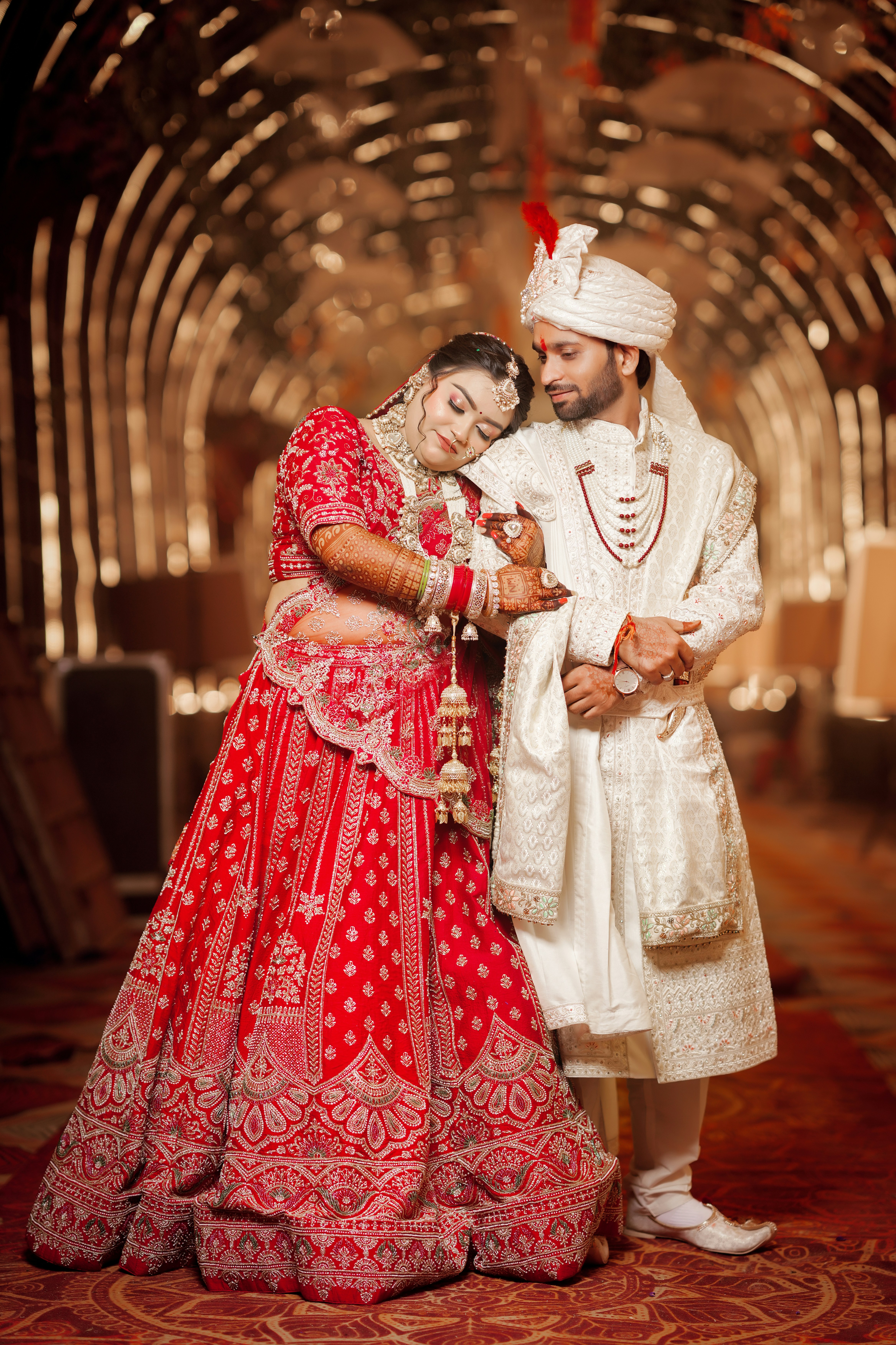 Red-White Harmony: A Bride and Groom in a Golden Corridor