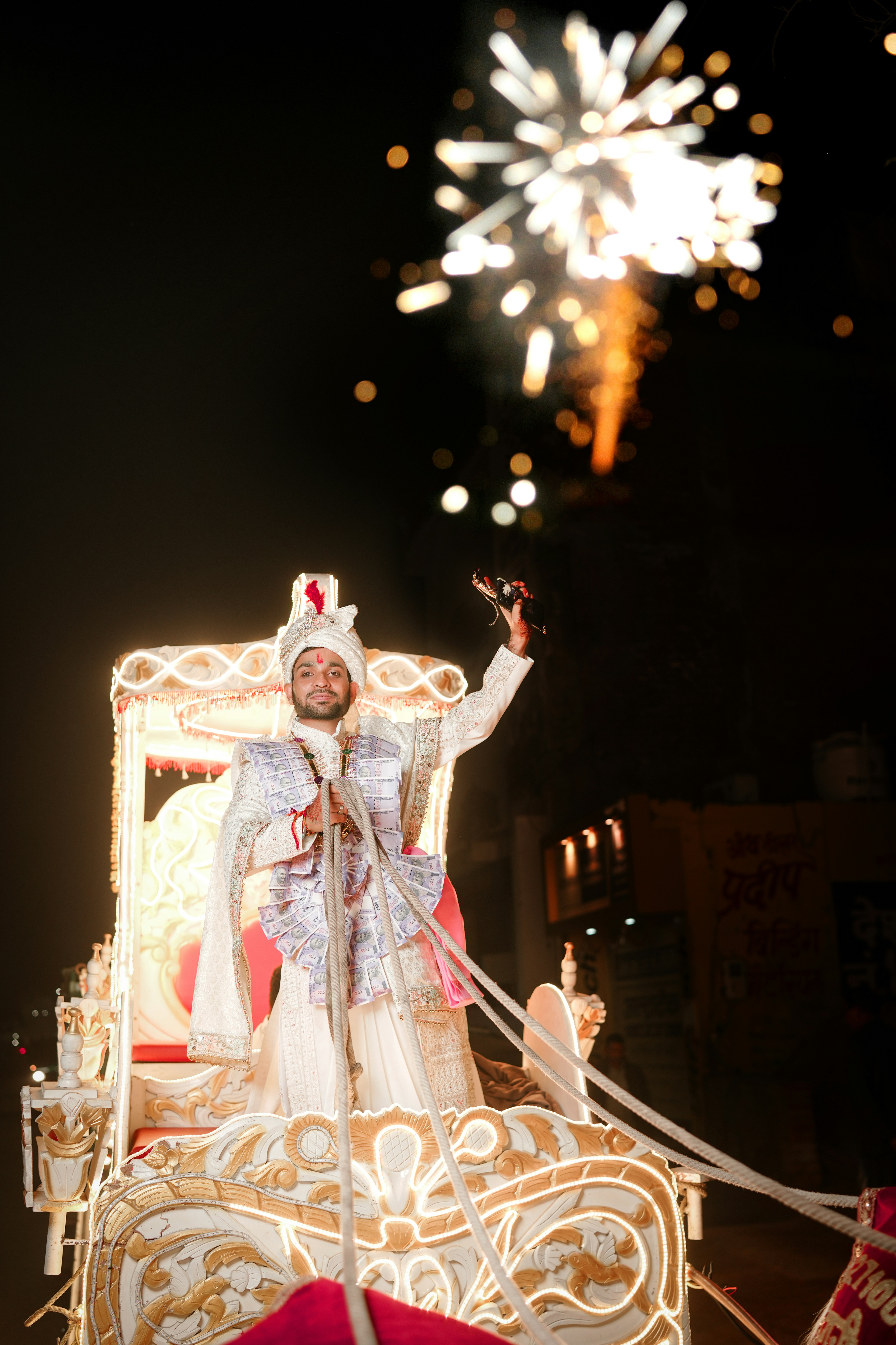 Festival Knight: A Festive Groom Rides a Luminous Carriage Under Fireworks