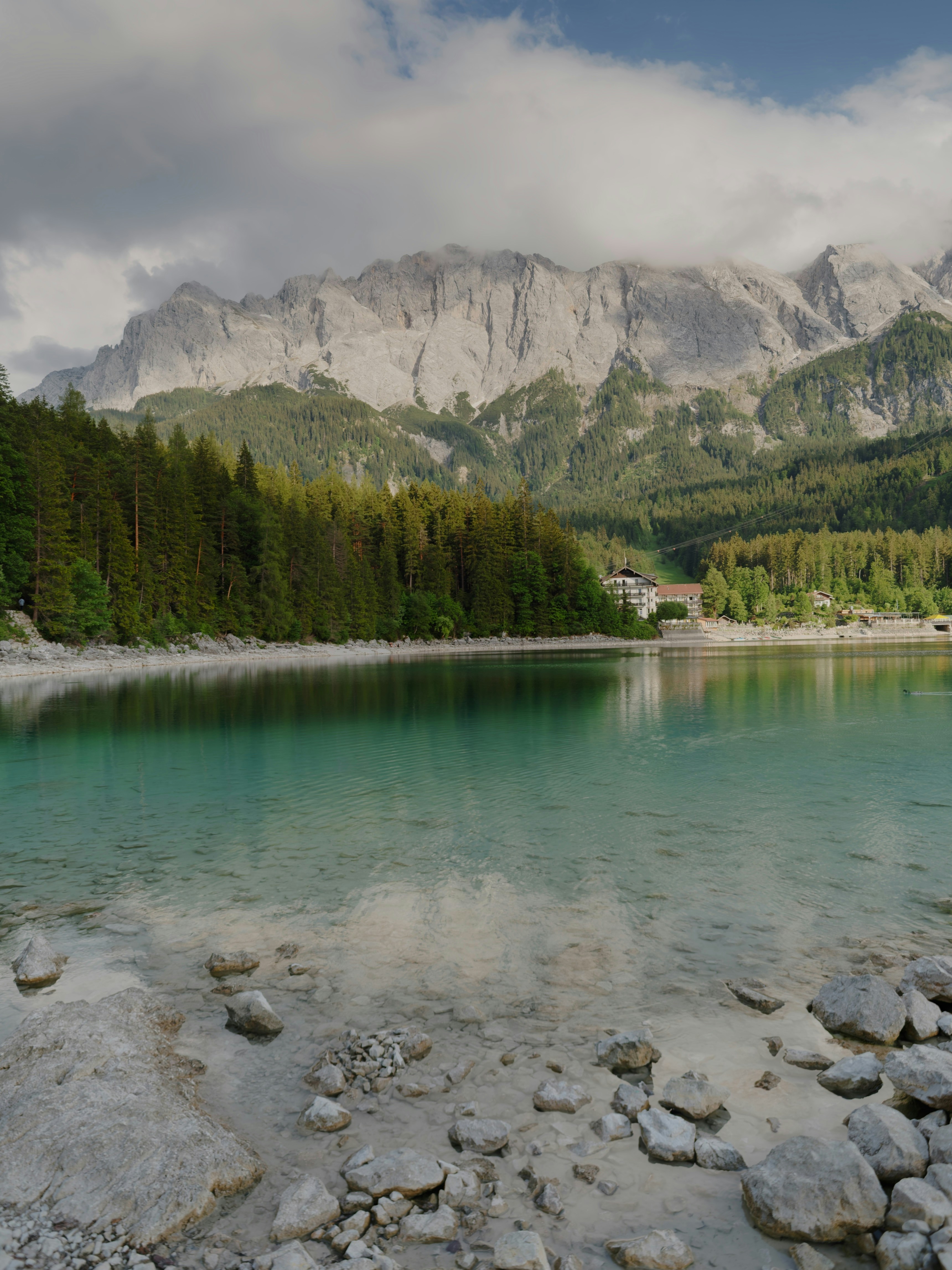 Emerald Shoreline Under Alpine Peaks