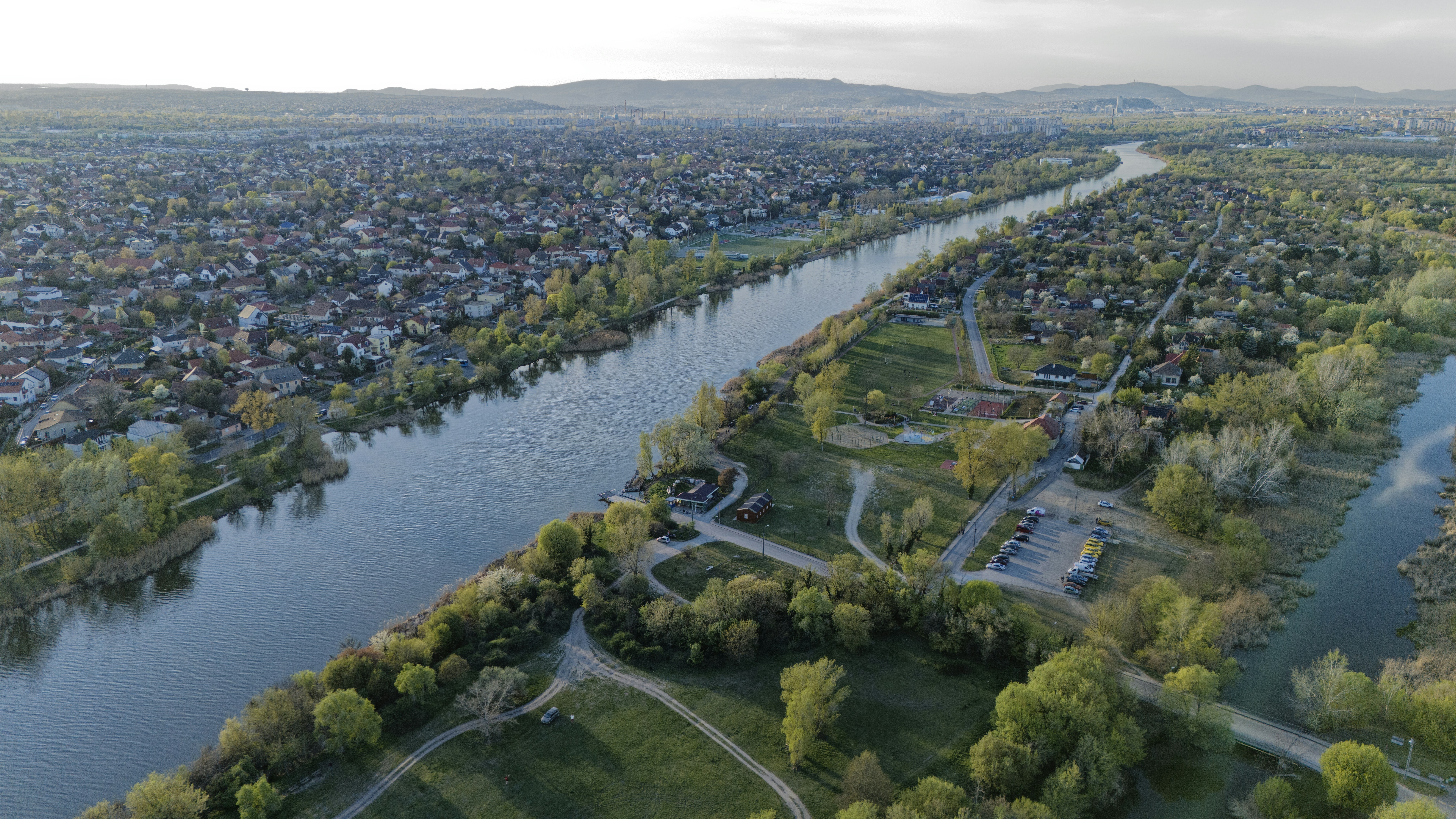 Riverbend Village: Aerial Ribbon Through Green and Gray