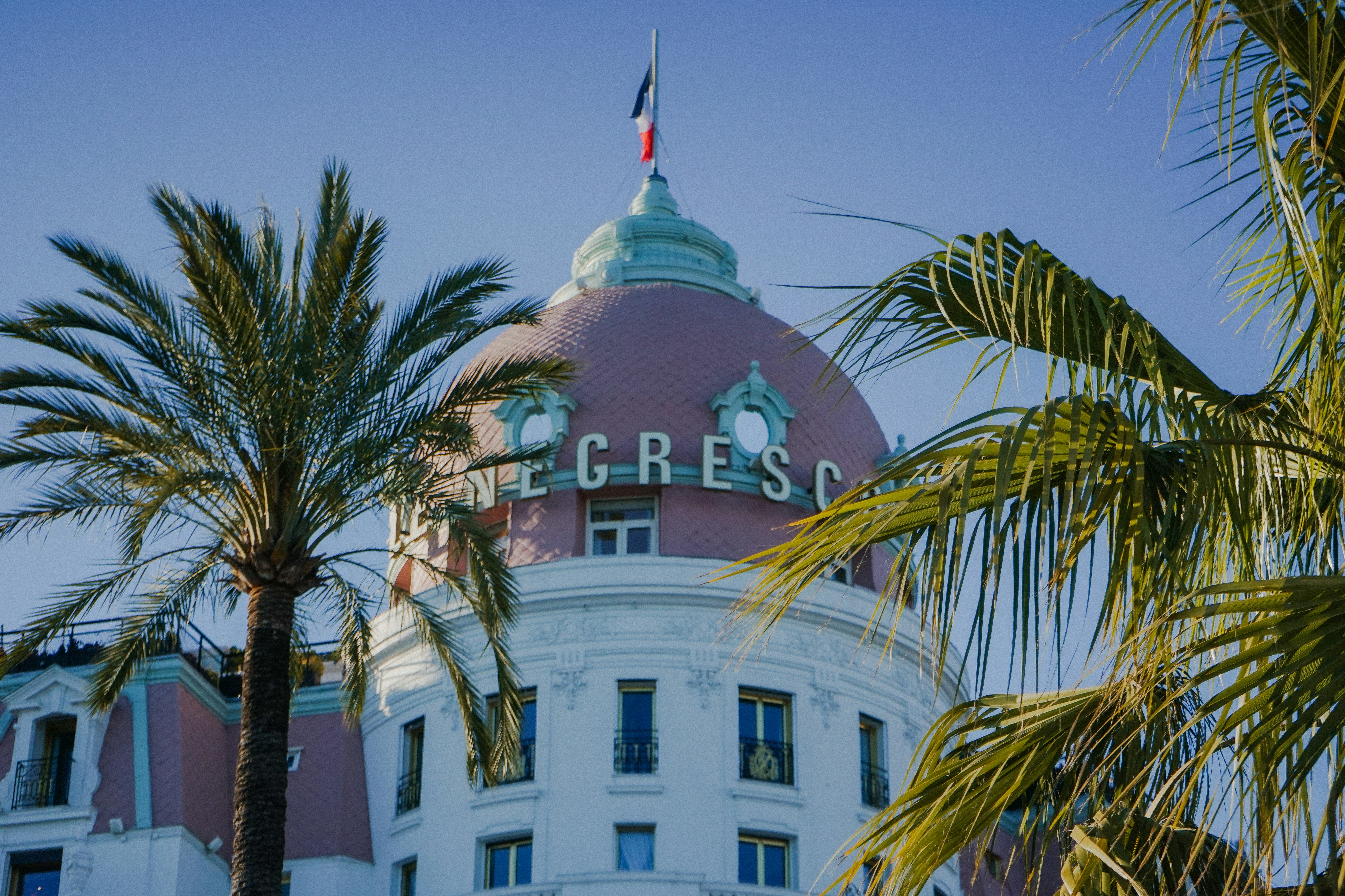 Tropical Facade: The Elegant Dome of Le Palais in Sunset Light