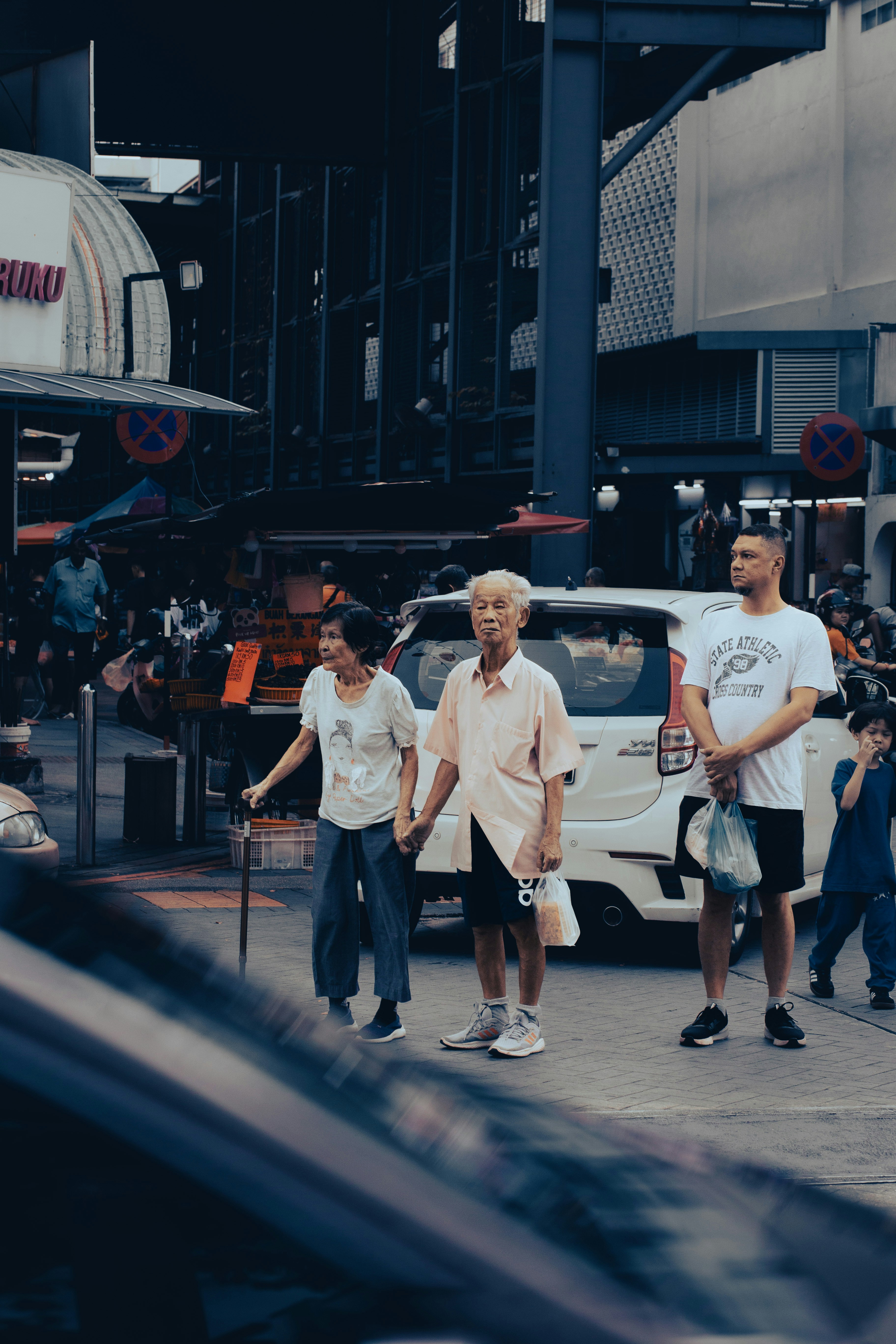 Standing Together: A City Street Moment with Elder and Family