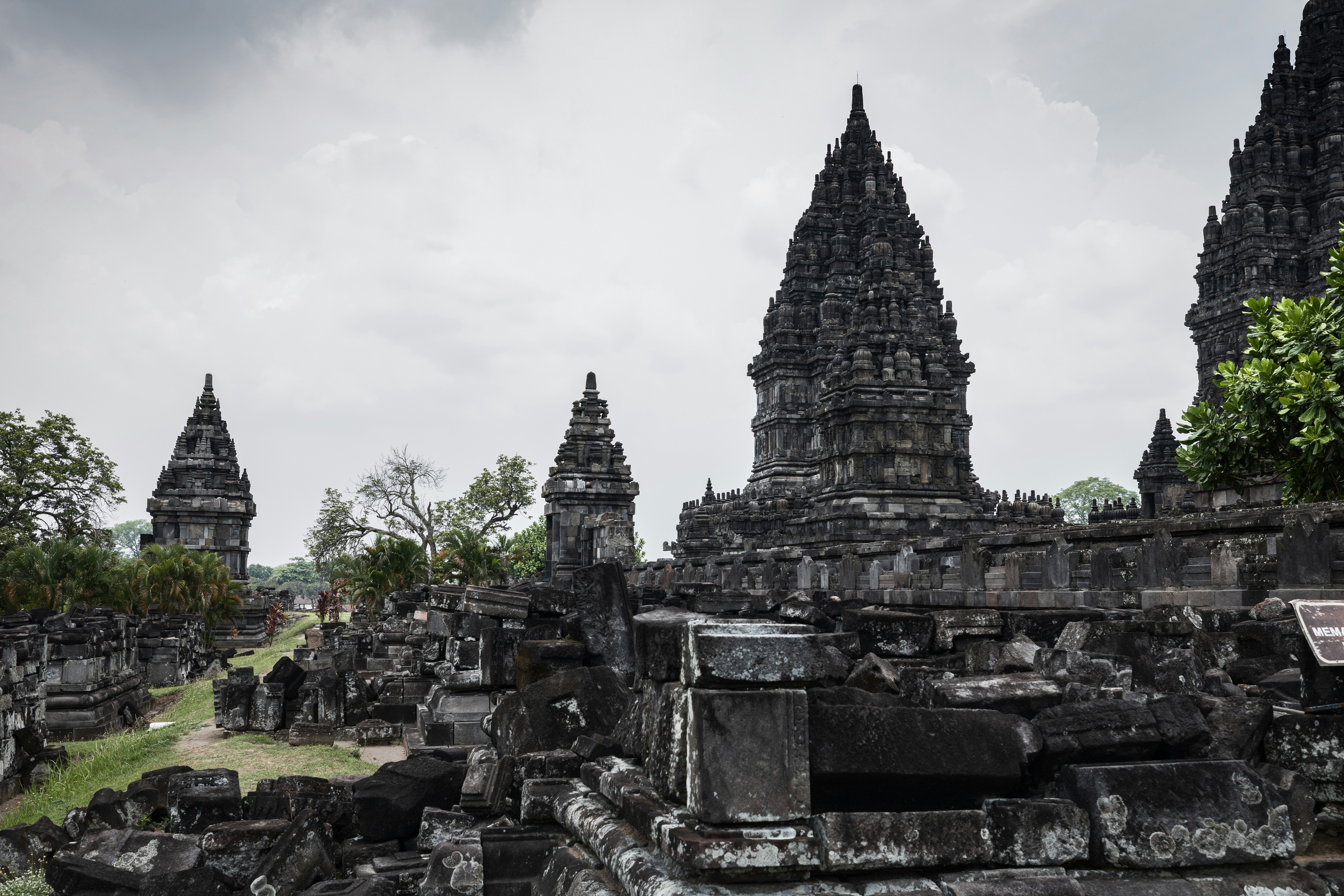 Ancient stone temples under a cloudy sky.