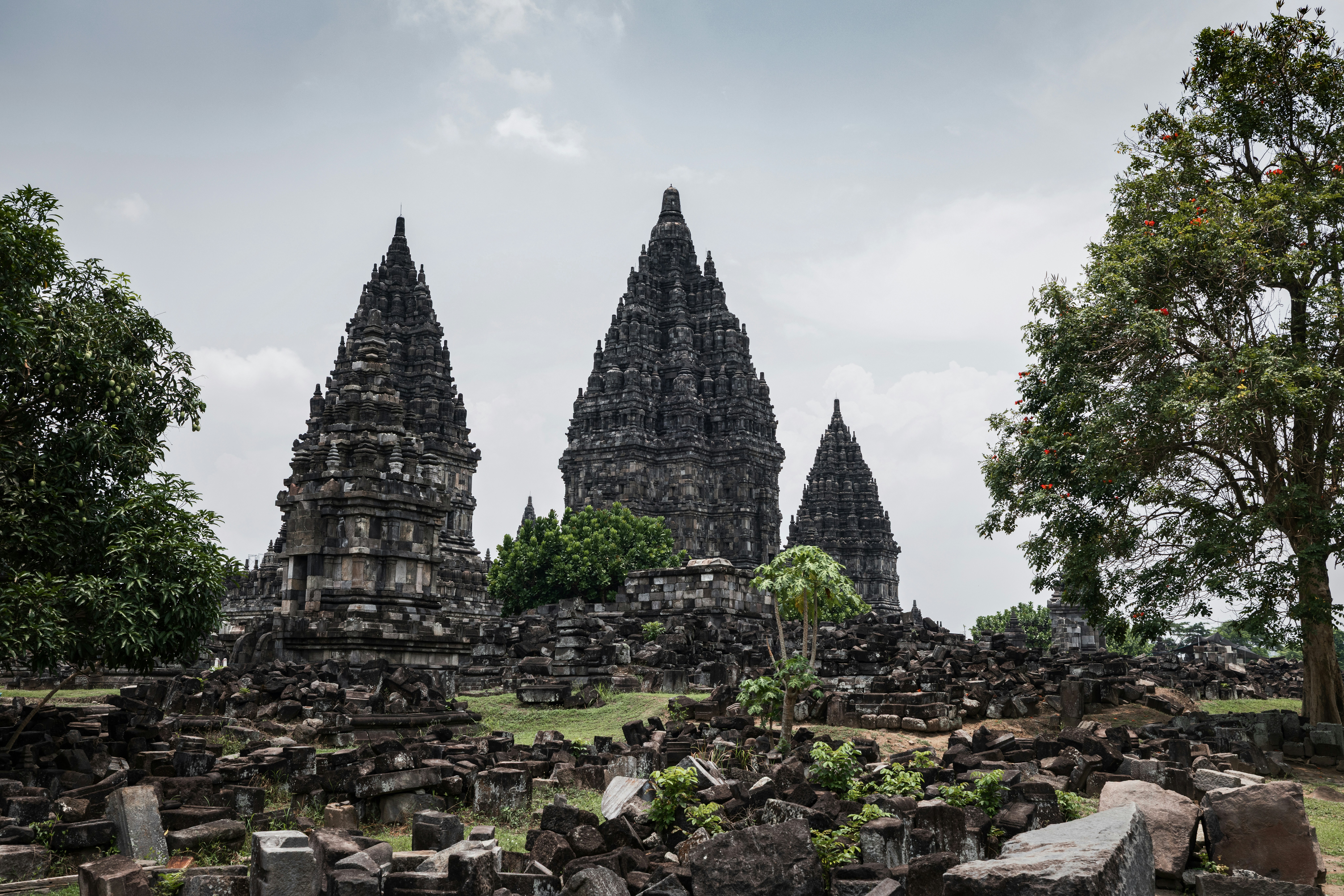Ruined Towers of Angkor: Silent Sentinels Against a Cloudy Sky