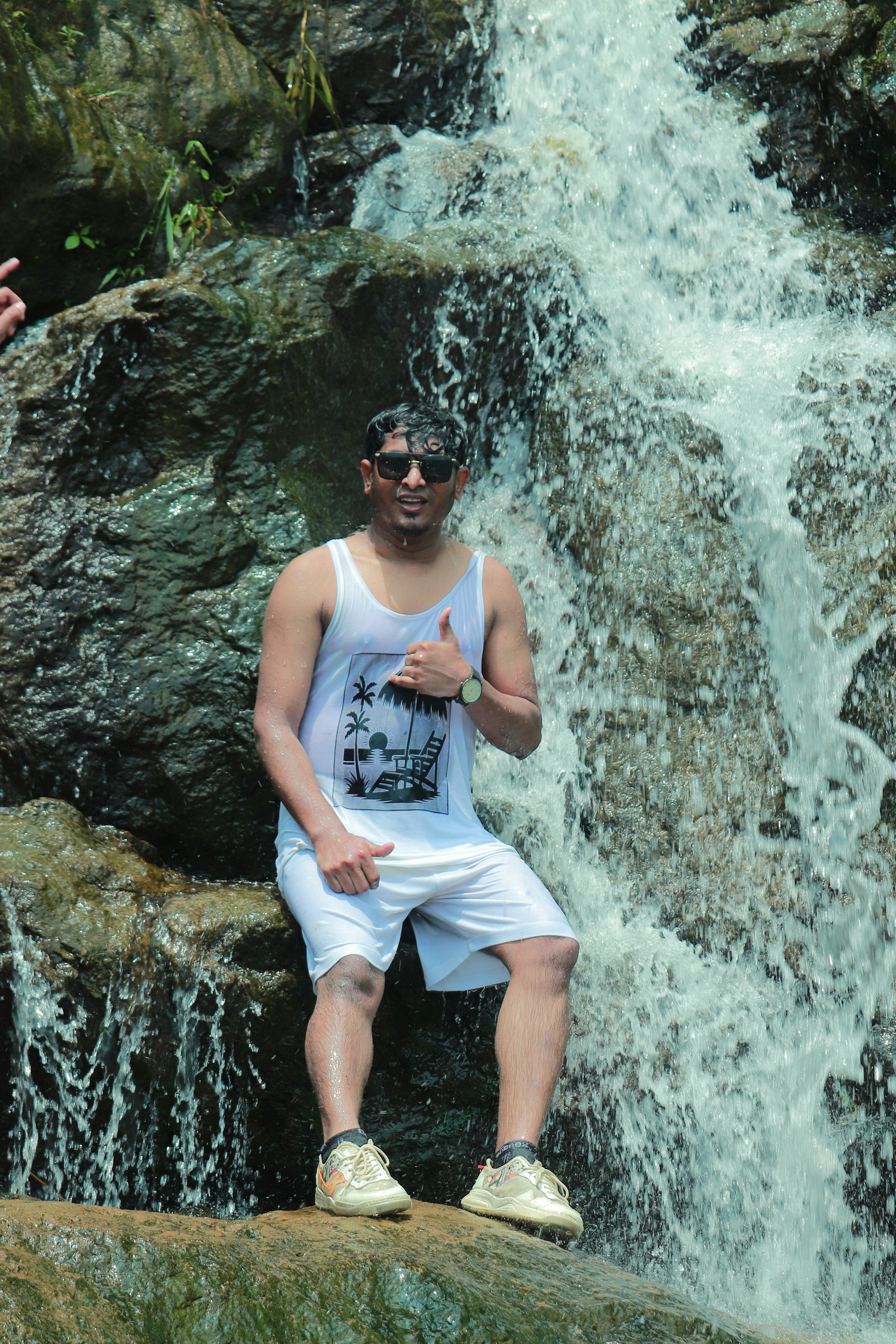 Waterfall Confidence: Man at the Cascading Gorge