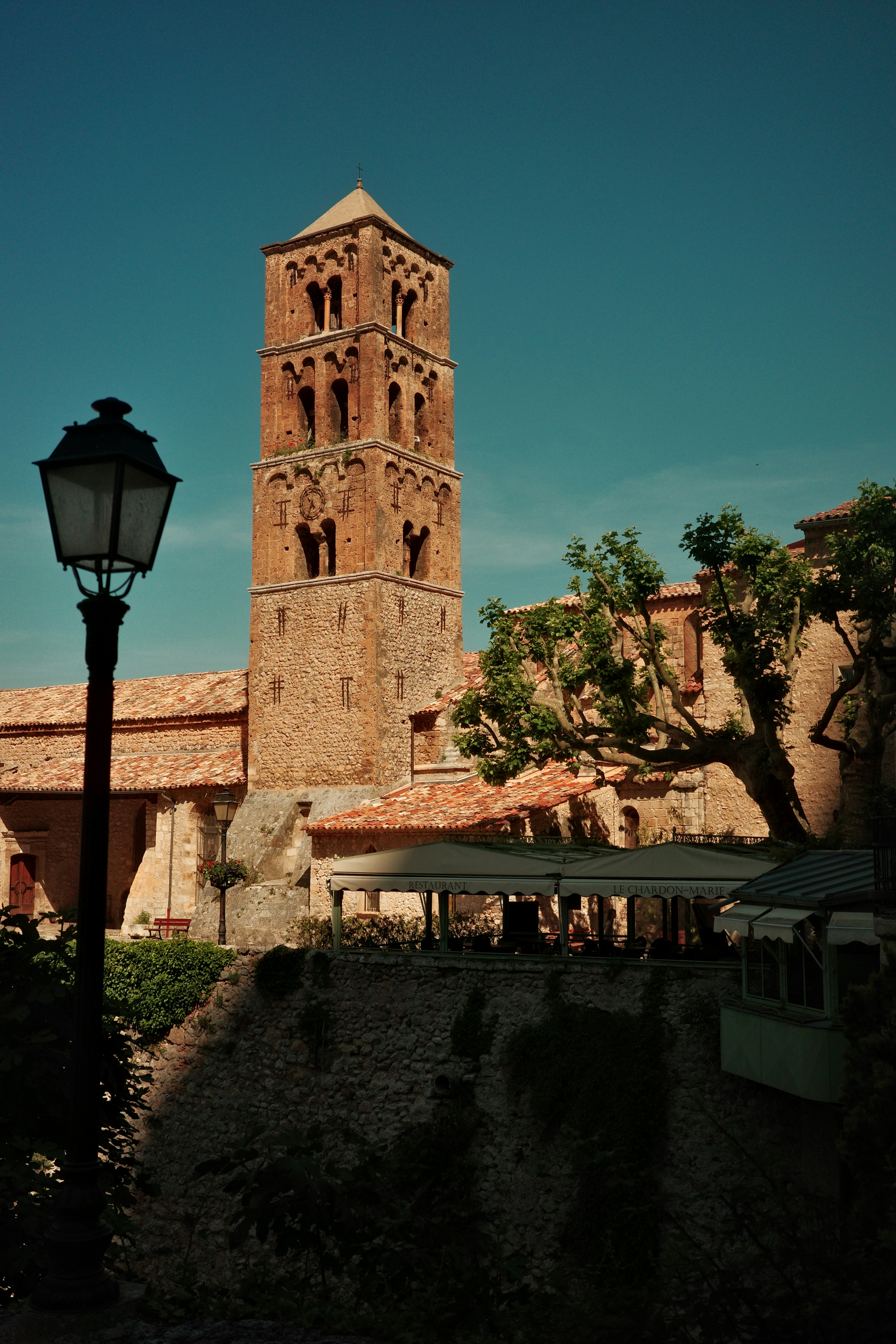 Stone Bell Tower under a Clear Mediterranean Sky