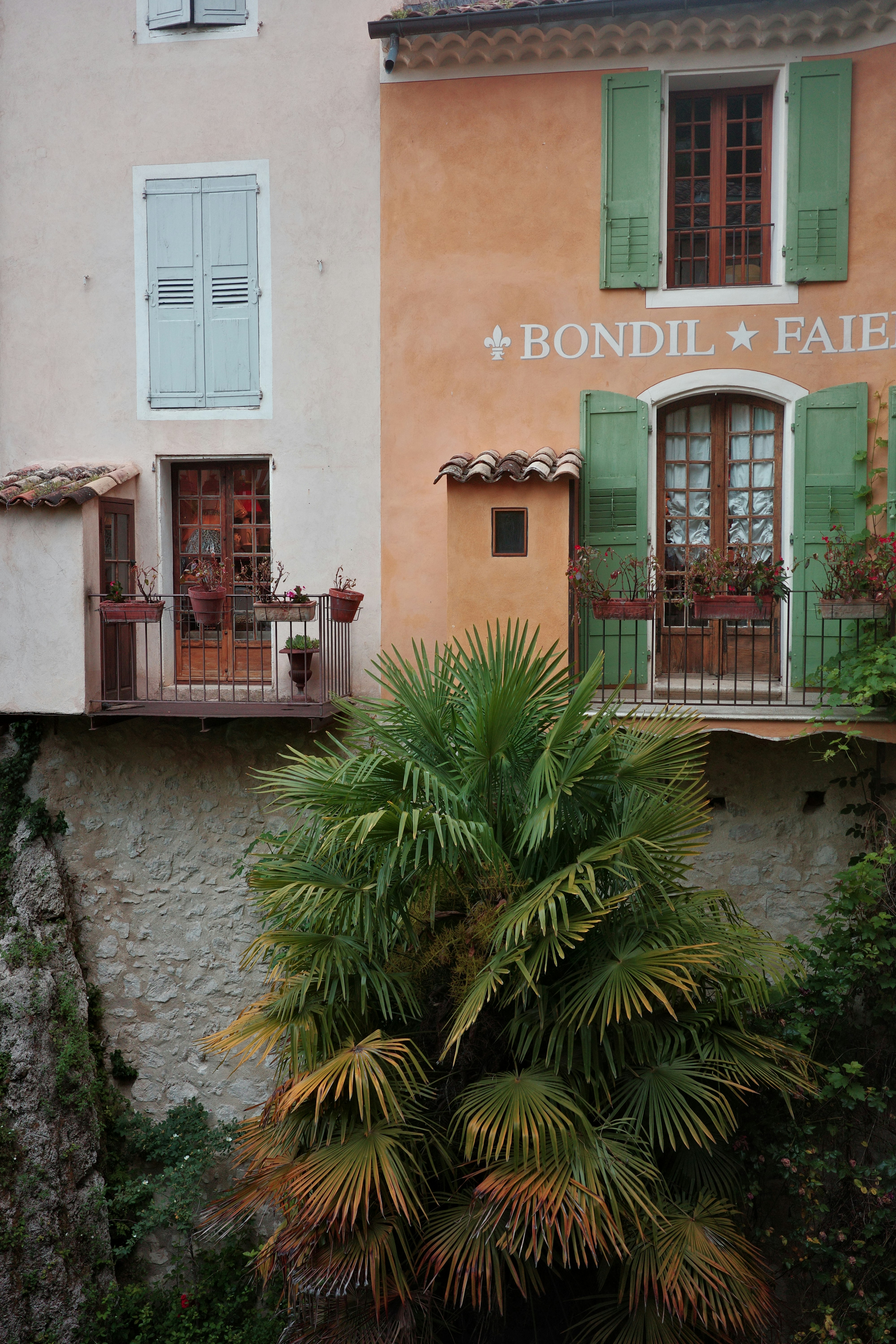 Sunlit Facade of a Mediterranean Guesthouse
