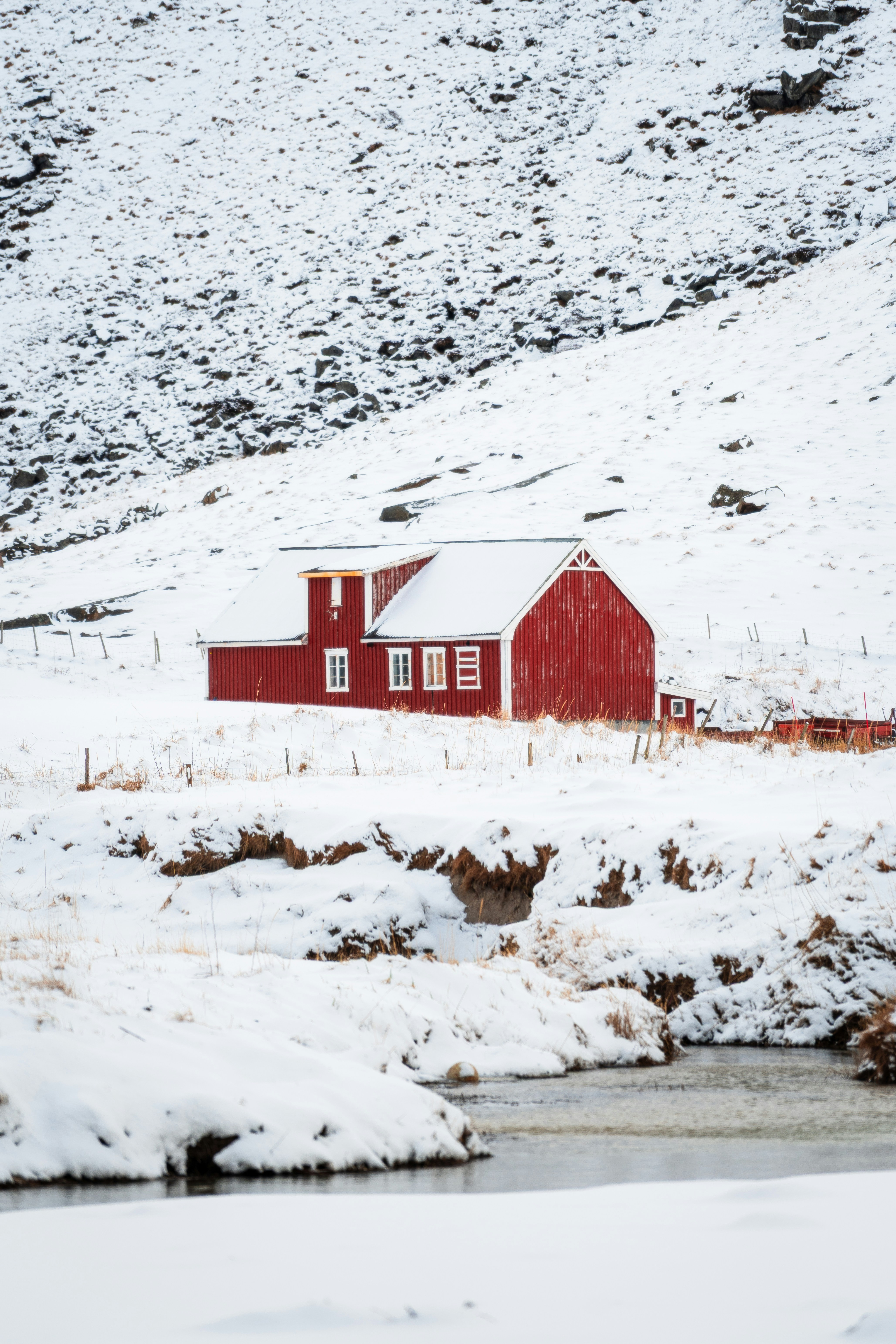 Red Barn Amid Winter Slopes