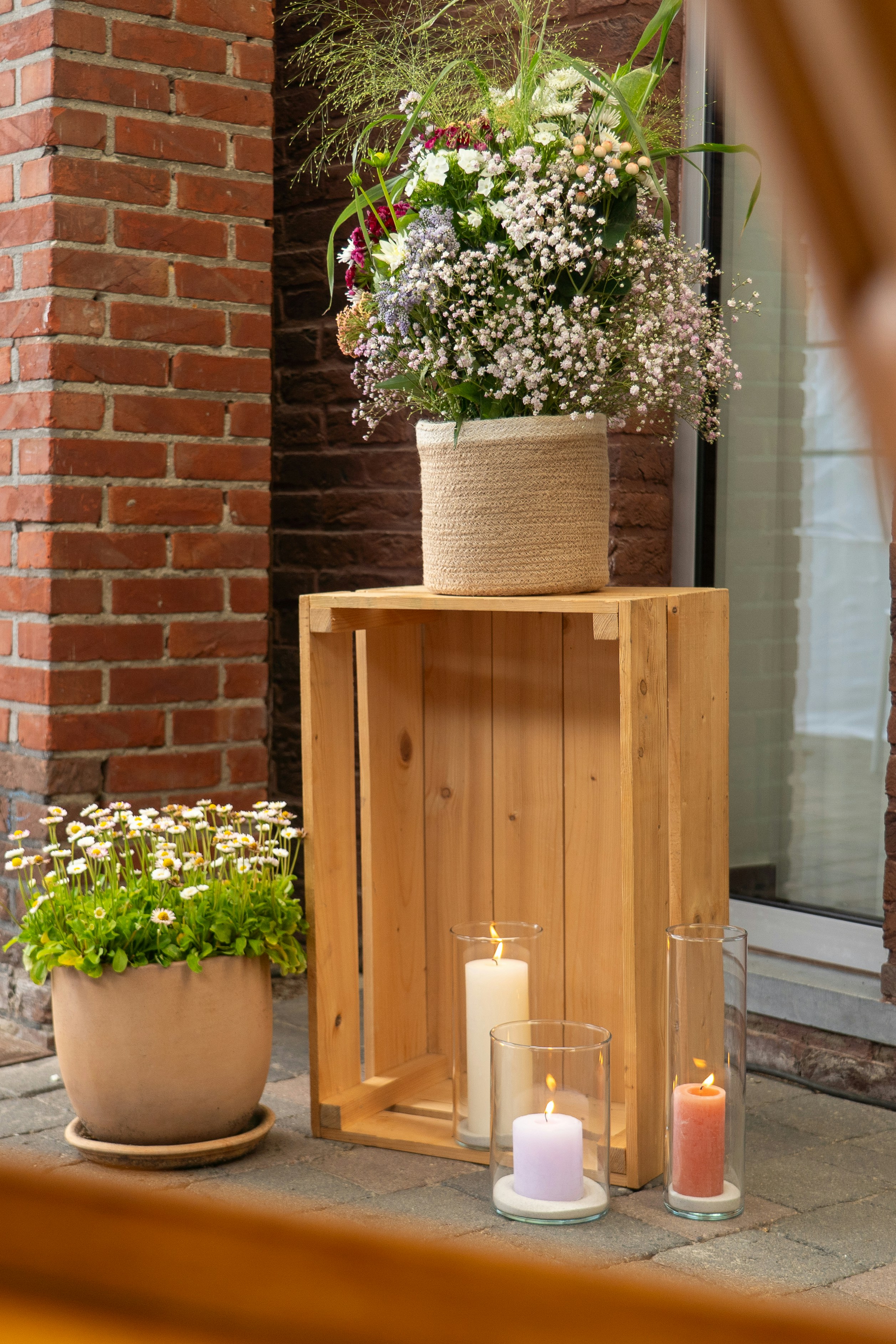 Floral Still Life on a Wooden Pedestal with Candled Lanterns
